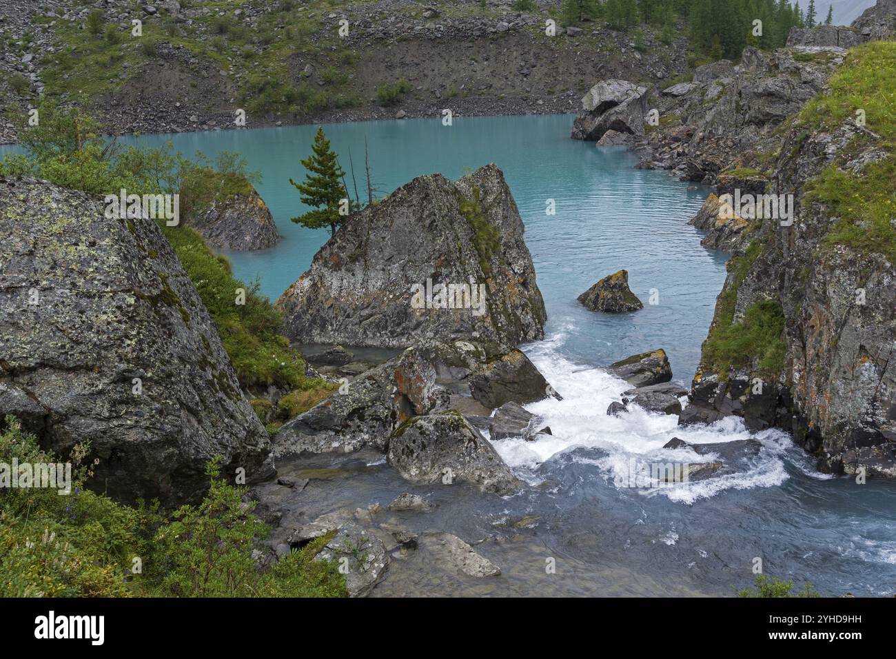 Water flows over a small rapids between the two parts of the Upper ...