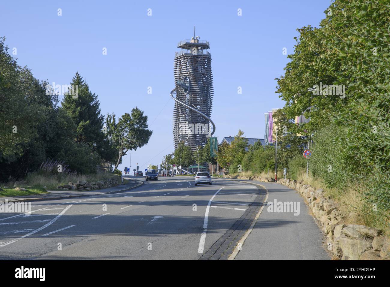 Road leads to observation tower, modern tower made of wood and steel ...