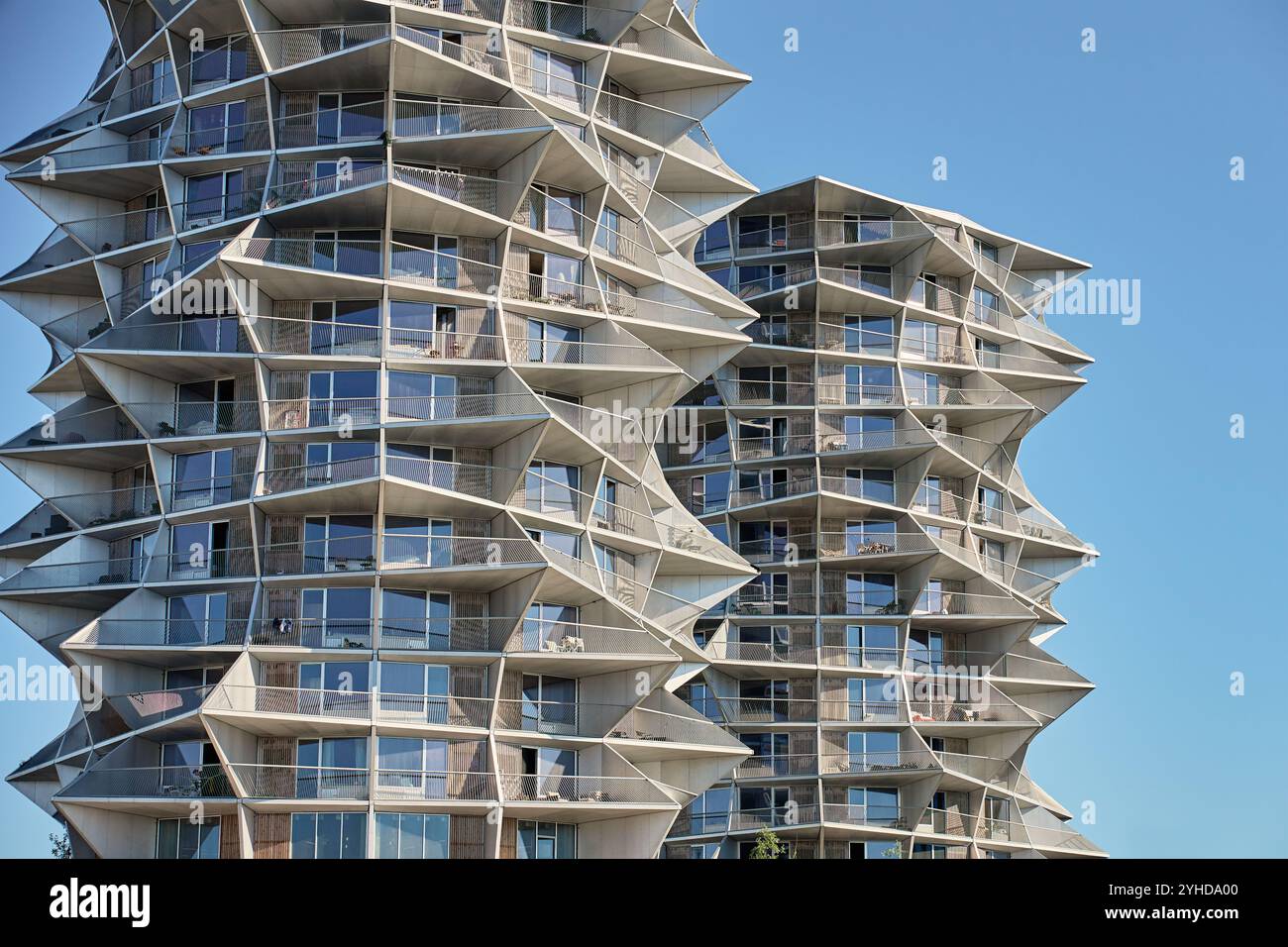 Facade of modern residential building with geometric shapes against ...