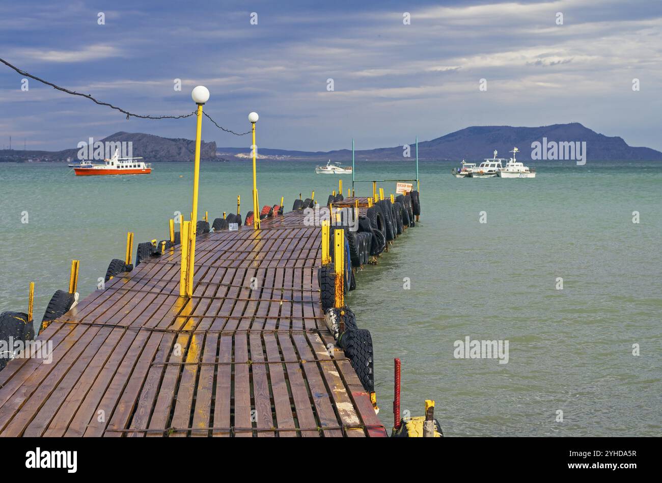 A small jetty in cloudy weather. Crimea, the Black Sea coast Stock ...