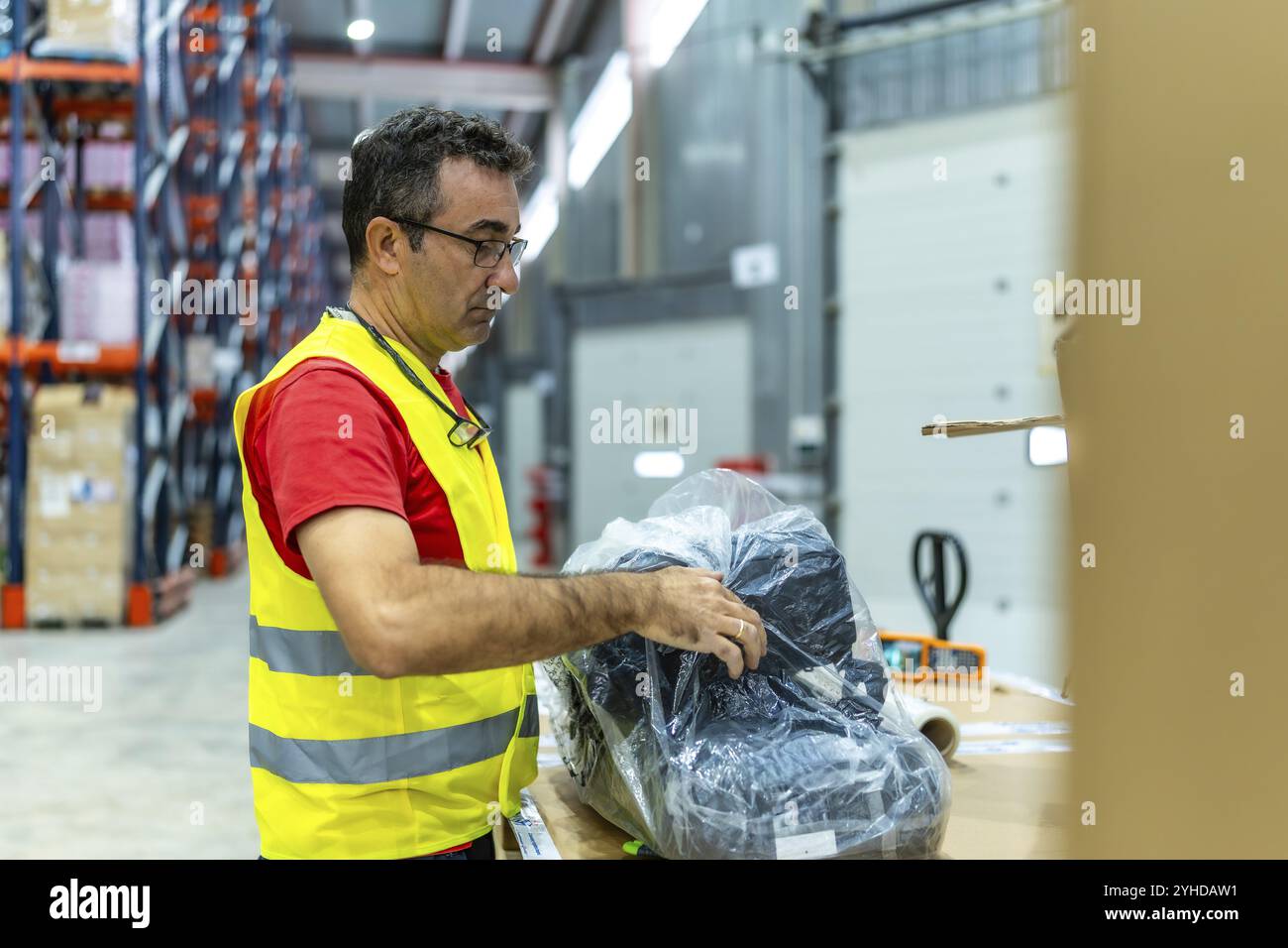 Three quarter length photo of a mature man in waistcoat organizing and ...