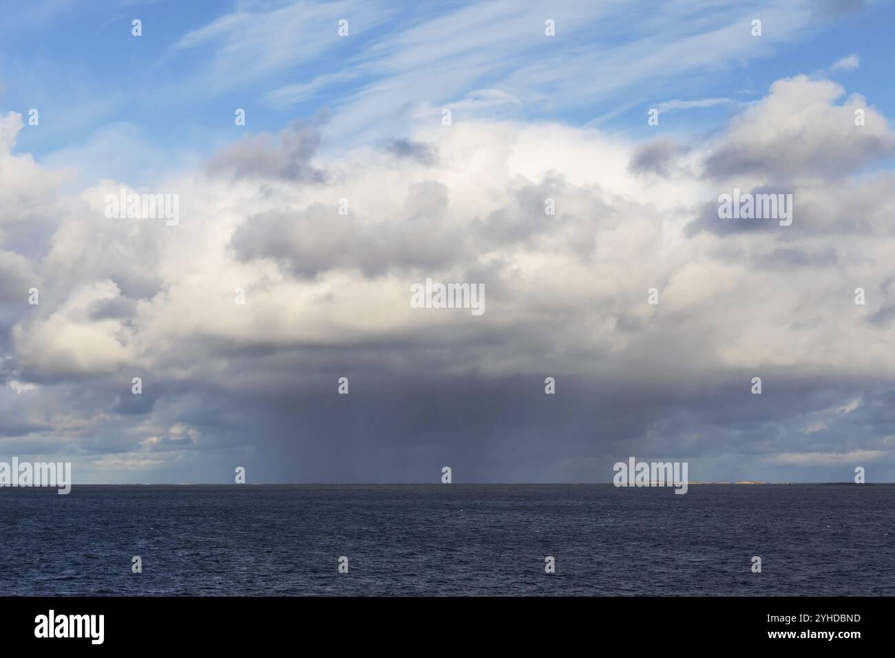 Large rain cloud over the Atlantic, Norwegian Sea. Cumulus cloud with ...