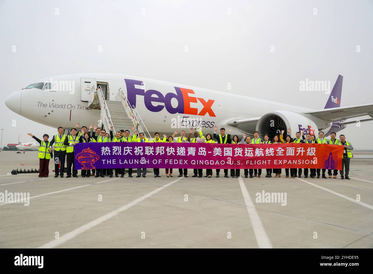 QINGDAO, CHINA - NOVEMBER 11, 2024 - Flight crew members pose for a group photo with fedex and ...