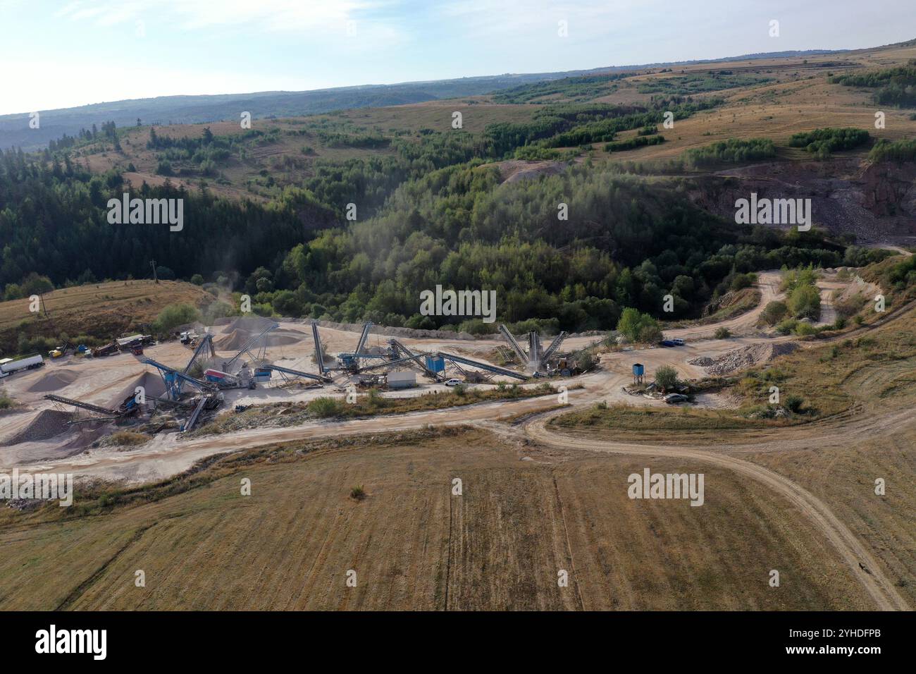 Aerial view of stone quarry conveyor belt system in operation, stone ...