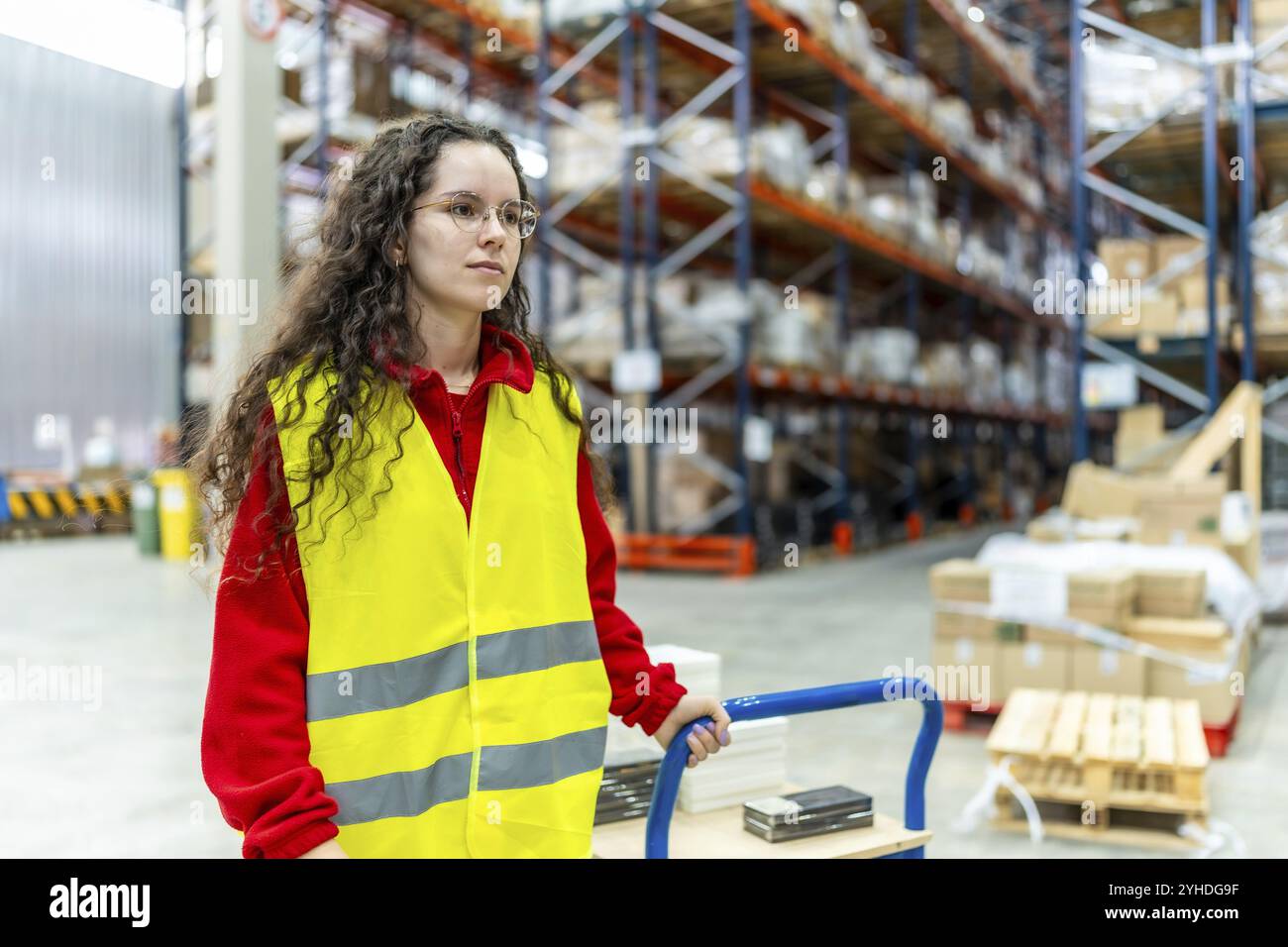 Woman carrying packages hi-res stock photography and images - Alamy