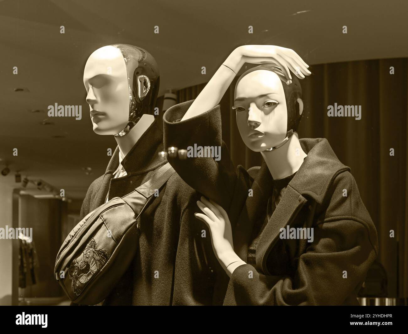 Showcase of an expensive clothing store. Futuristic-looking mannequins ...