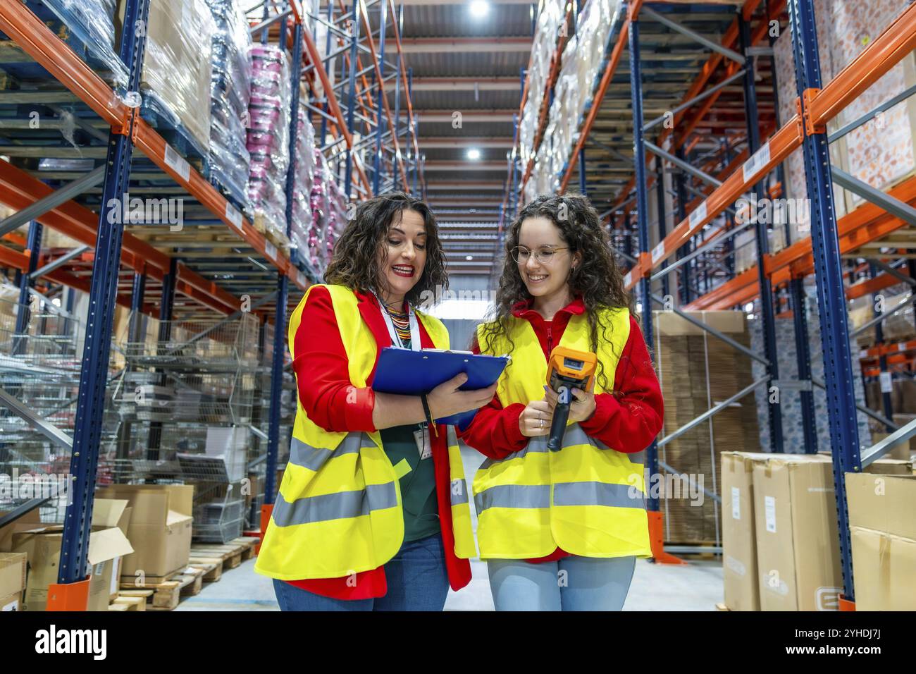 Female beauty manager talking to other female employee in a ...