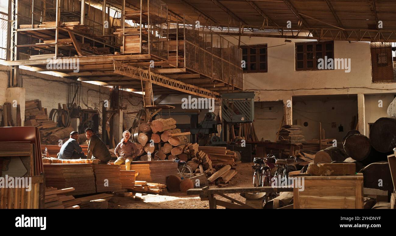 Varanasi, India. Indian men workers resting at the sawmill Indoor Stock ...