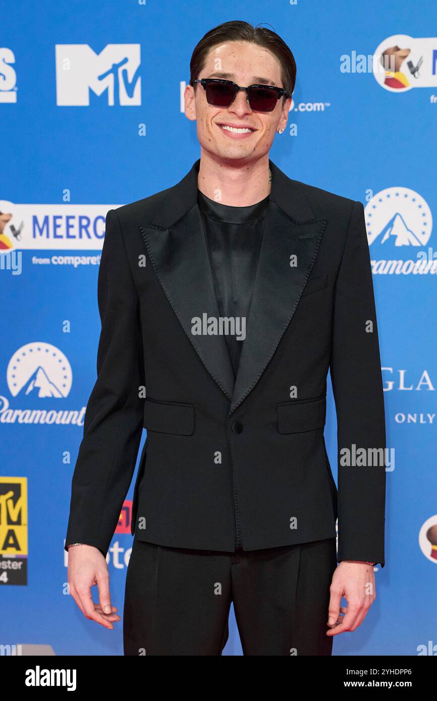 Peso Pluma poses for photographers upon arrival at the MTV European ...