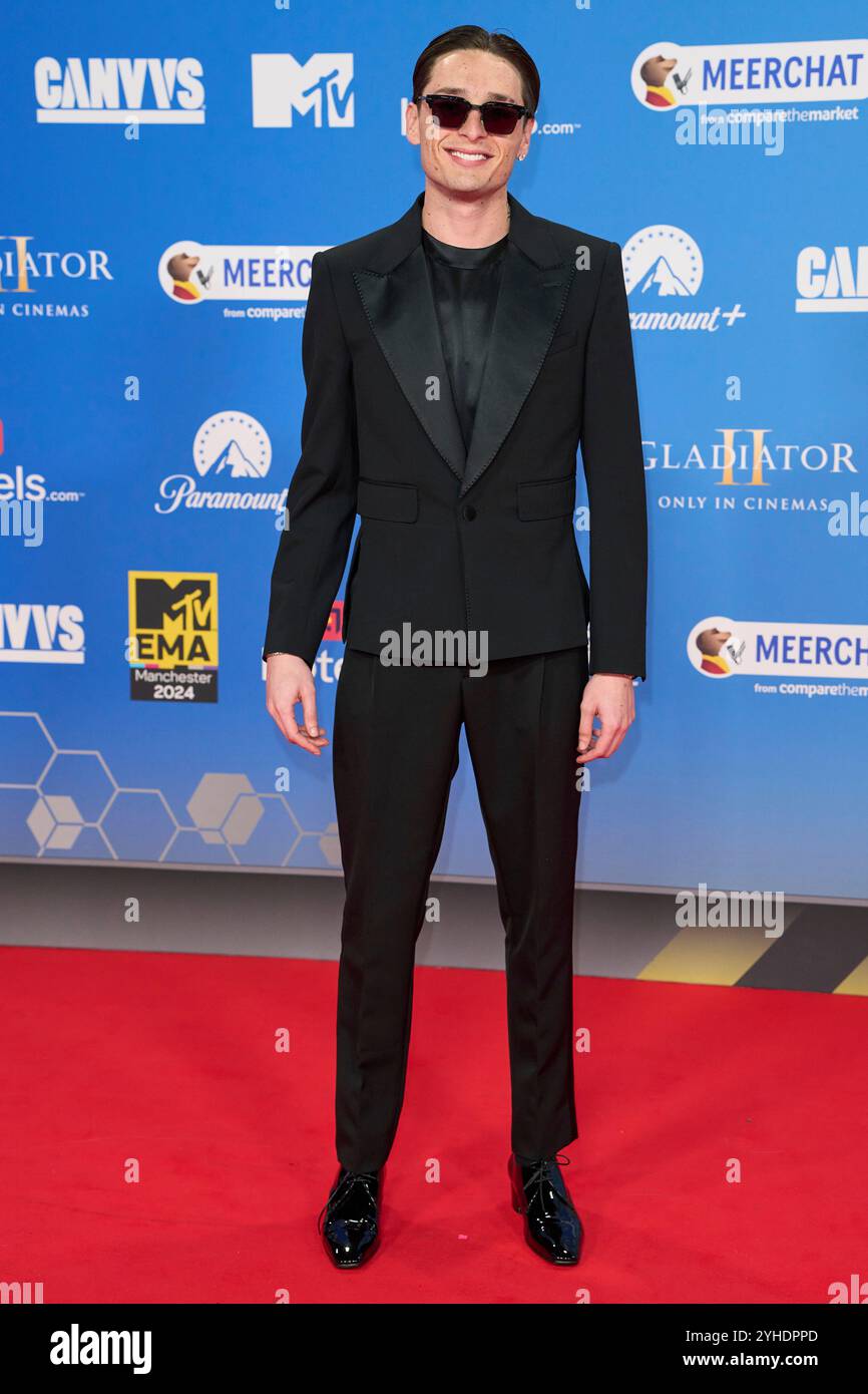 Peso Pluma poses for photographers upon arrival at the MTV European ...