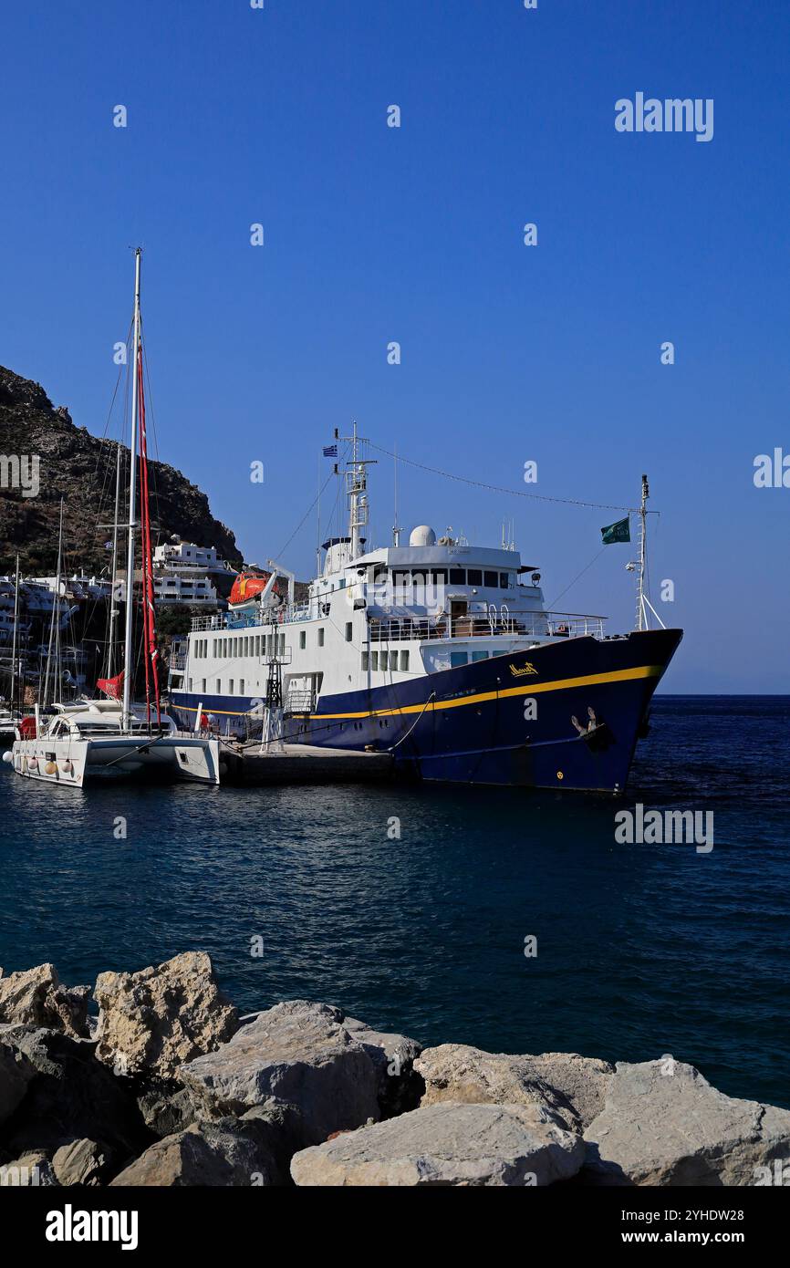The Monet small cruising ship moored at Livadia Harbour, Tilos Island ...