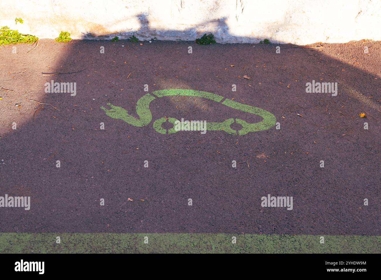 Electric Vehicle Charging Station Symbol on Pavement Stock Photo - Alamy