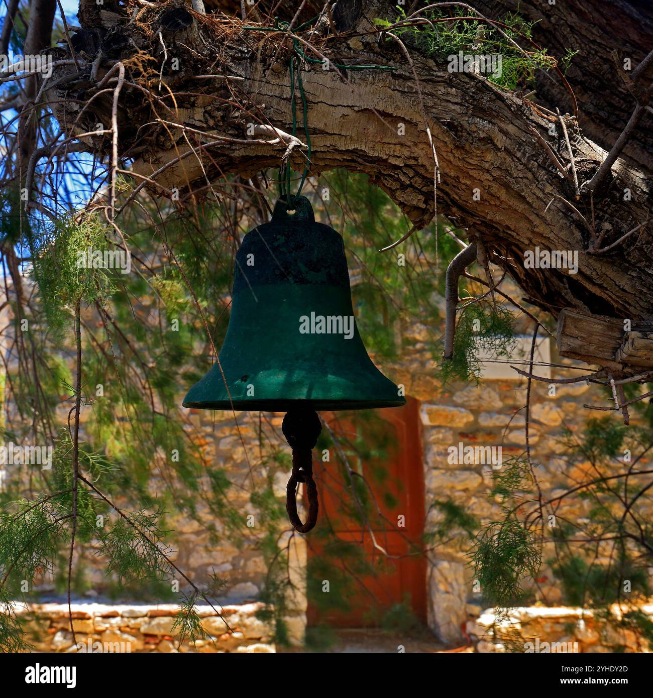 Outdoor church bell hanging from an old tree at Agios Iorgos church ...
