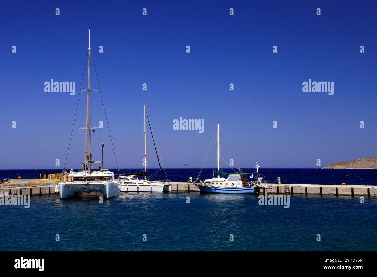 Boats at Livadia harbour, traditional fishing and ferry port, Tilos ...