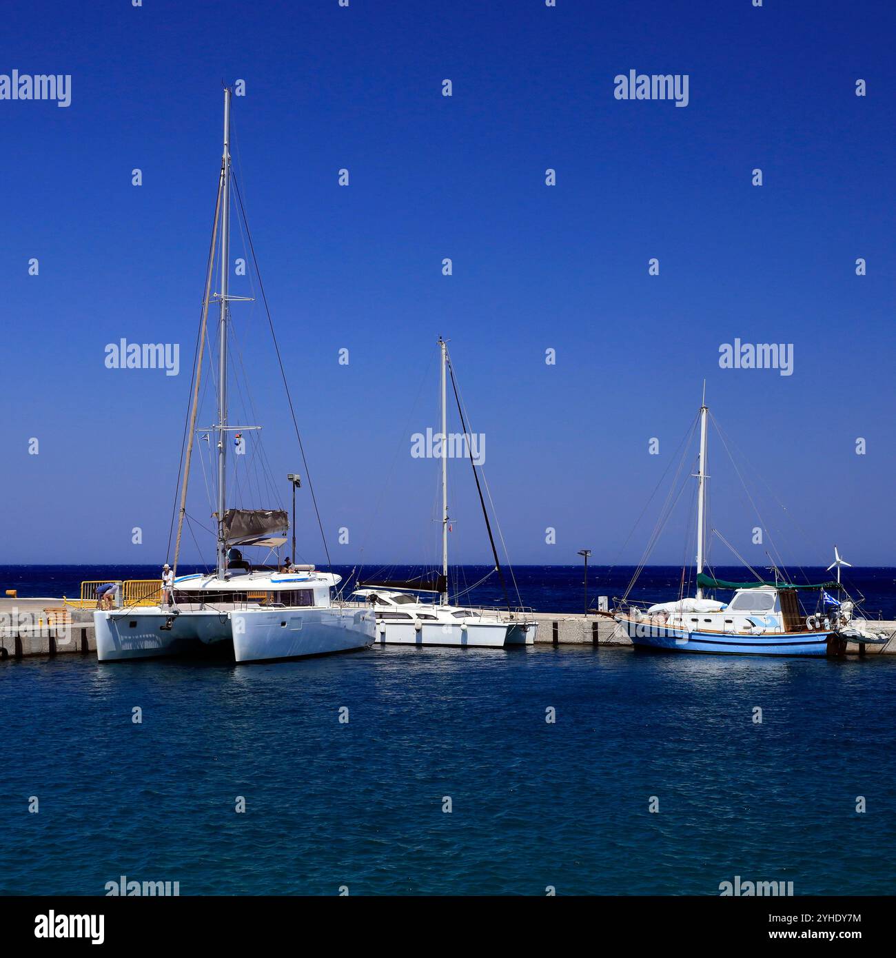 Boats at Livadia harbour, traditional fishing and ferry port, Tilos ...