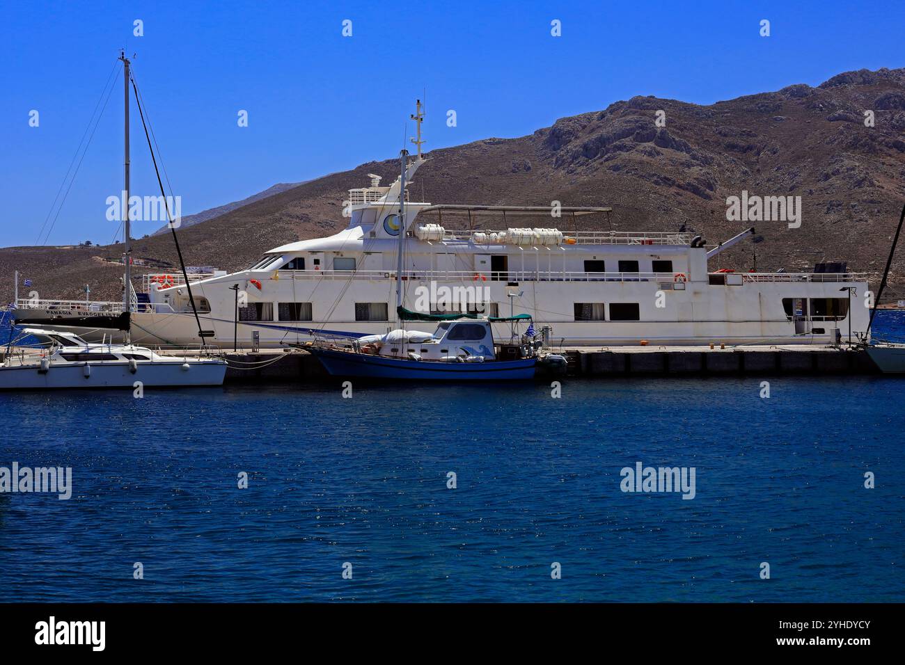 The Panagia Evaggelistria small ferry boat moored at Livadia harbour ...