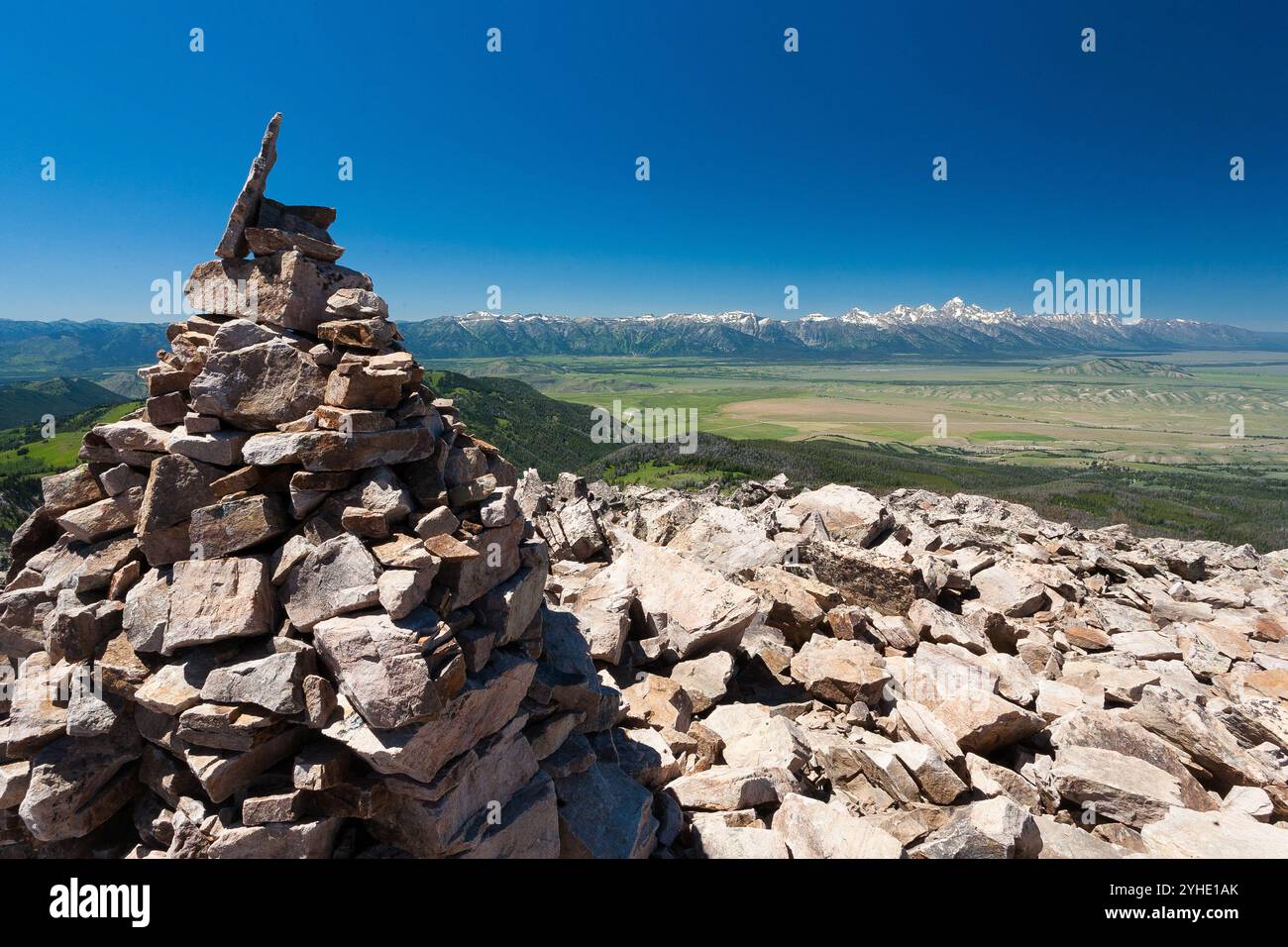 A large rock cairn stacked up on the summit of Jackson Peak. Gros ...