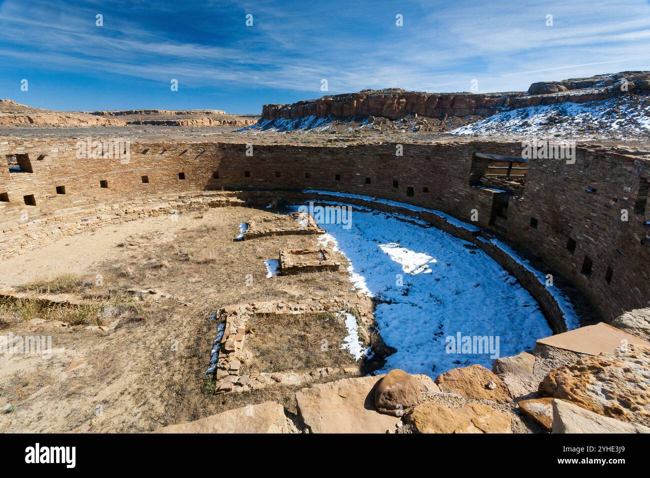 A large kiva dug deep into the ground at the Casa Rinconada ruins ...