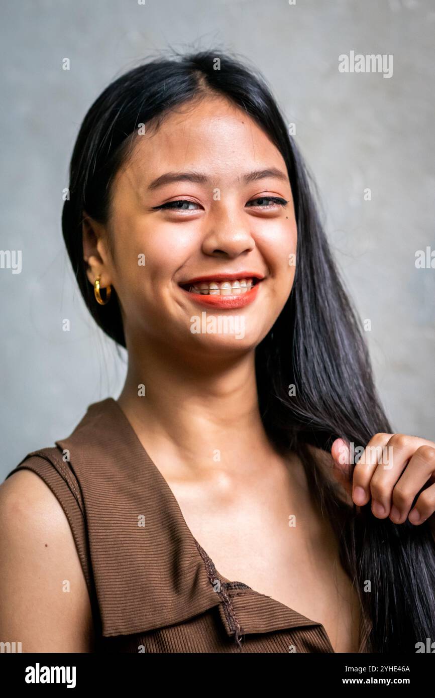 A Beautiful Young Filipino Girl Poses And Smiles In The Binondo District Of Manila The