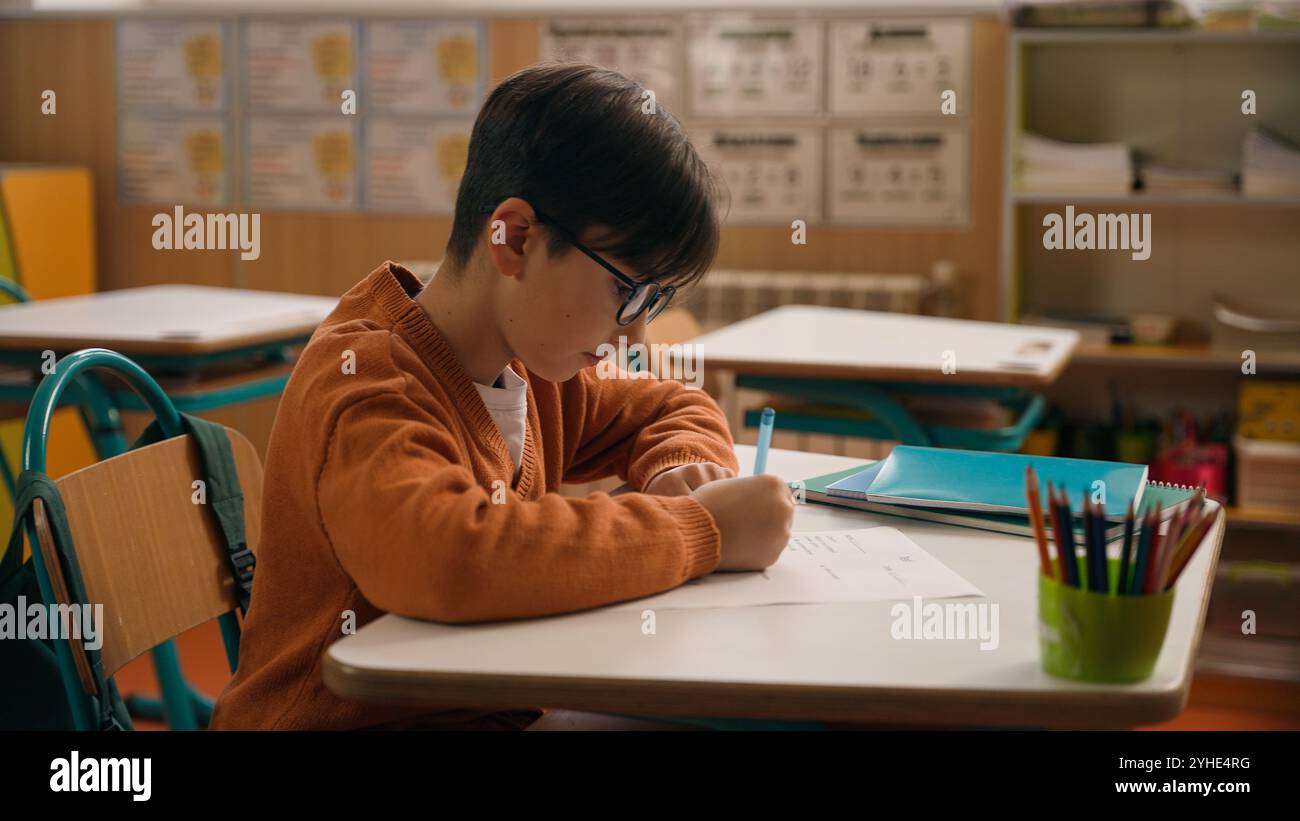 Caucasian guy boy think find idea ponder difficult task writing notes ...