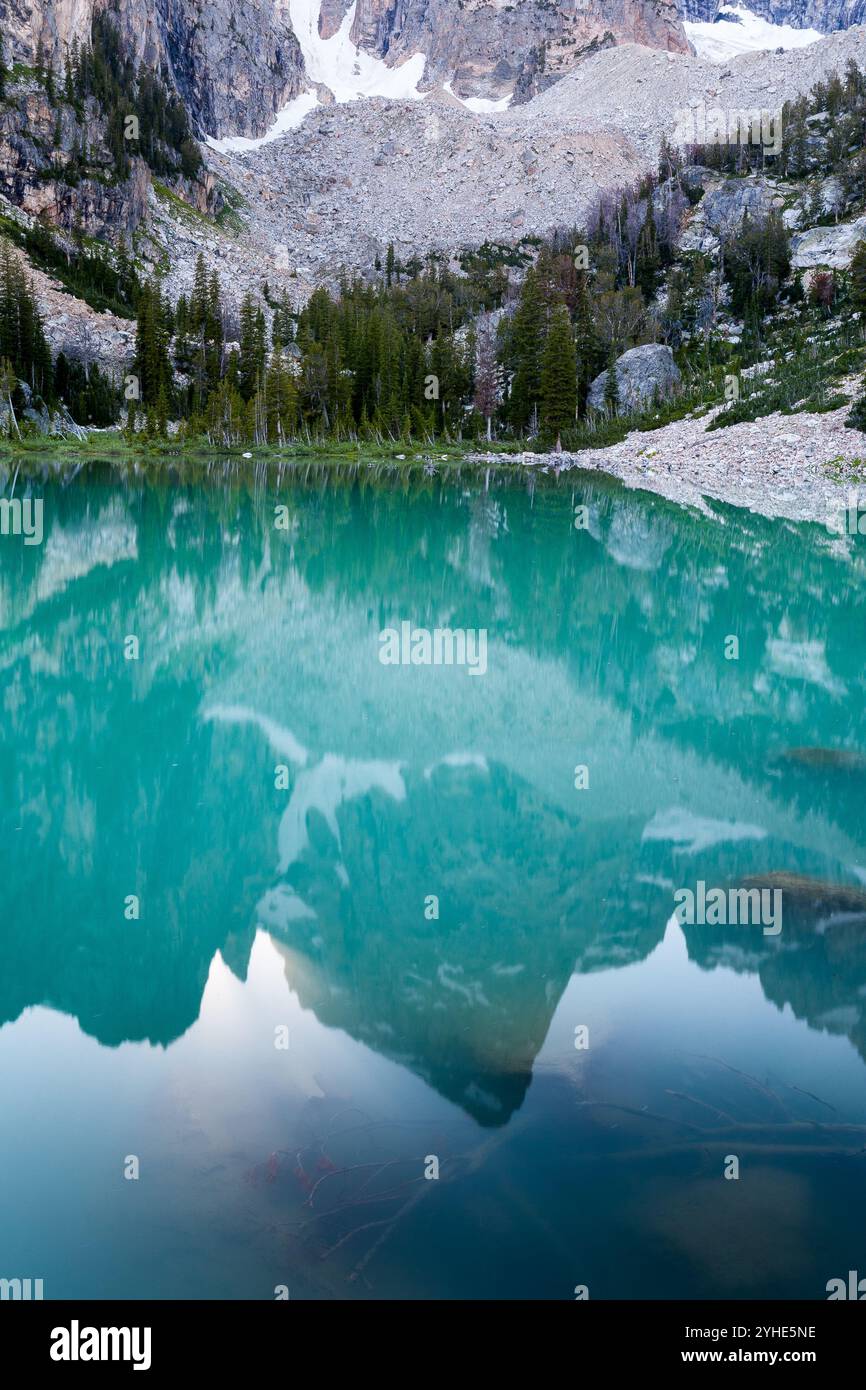The Grand Teton reflected in the turquoise waters of Delta Lake in the ...