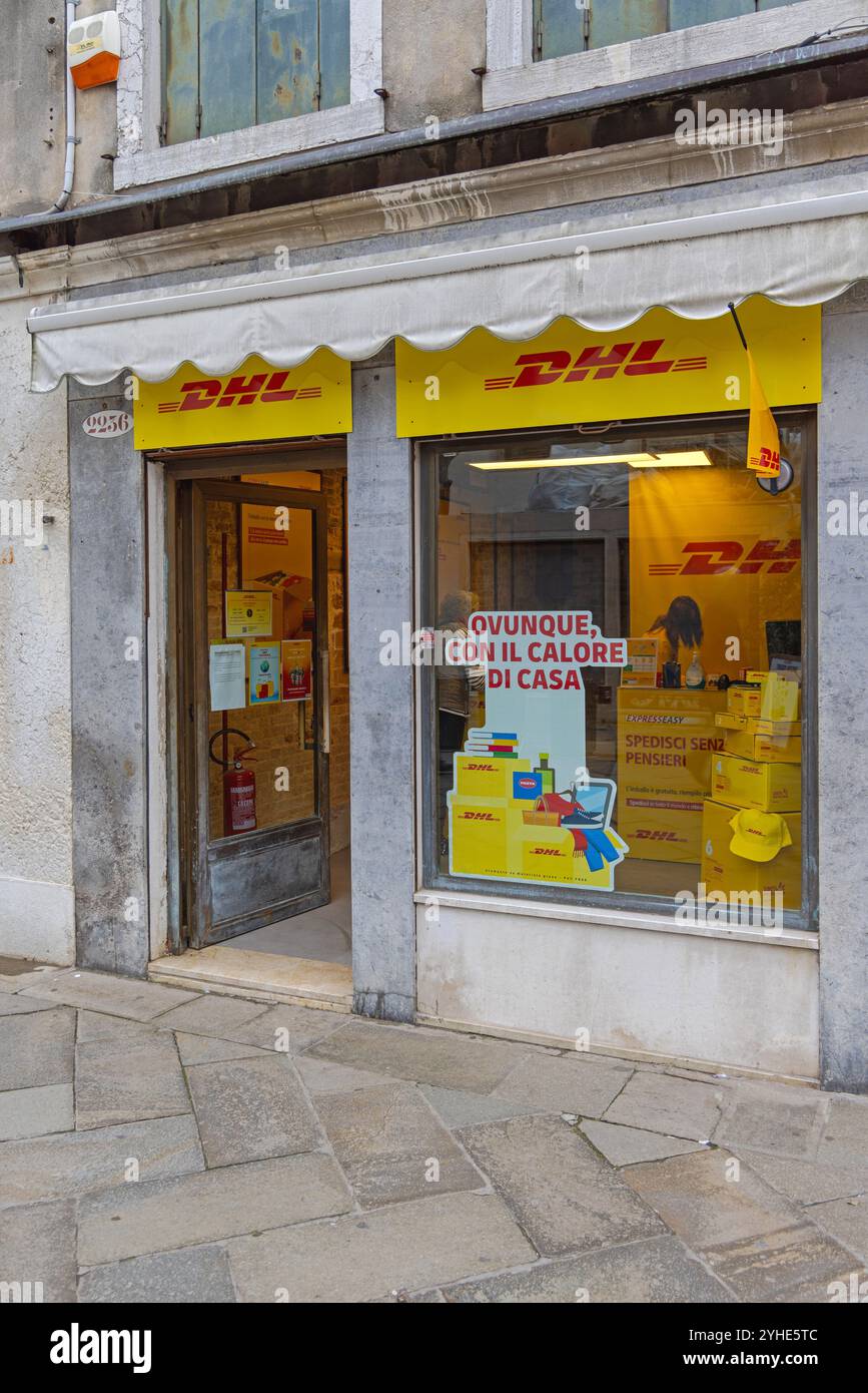 Venice, Italy - October 09, 2024: Shipping Service Courier Dhl Store at Strada Nova Street in ...