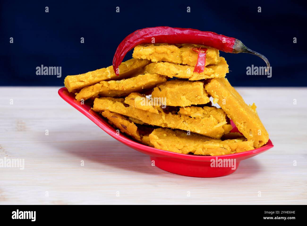 Side view of Gujarati Kathiyawadi Spicy Dhokali Sabji with a red chilli ...