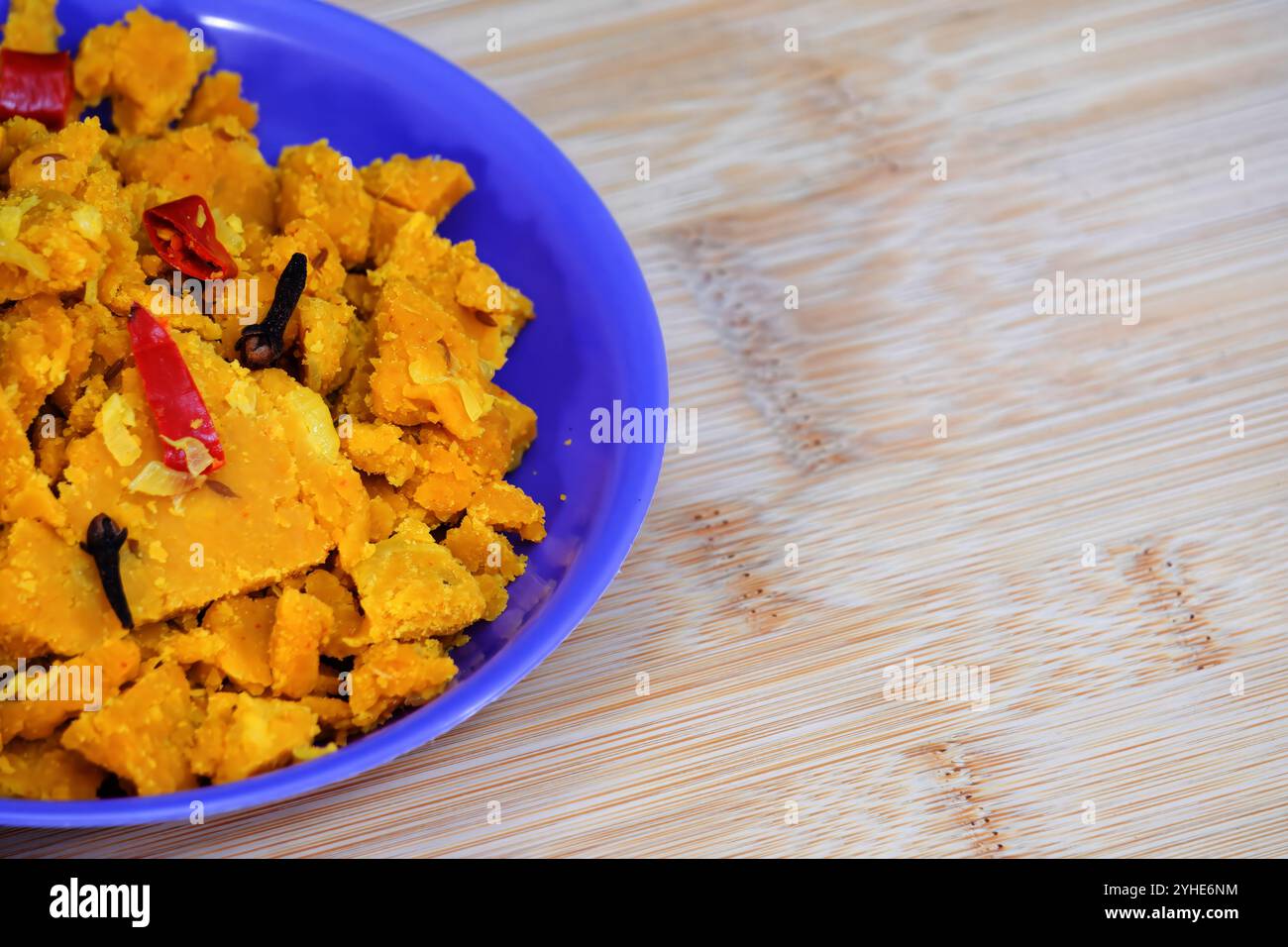 A side view of Gujarati Kathiyawadi Spicy Dhokali pieces Sabji reveals ...