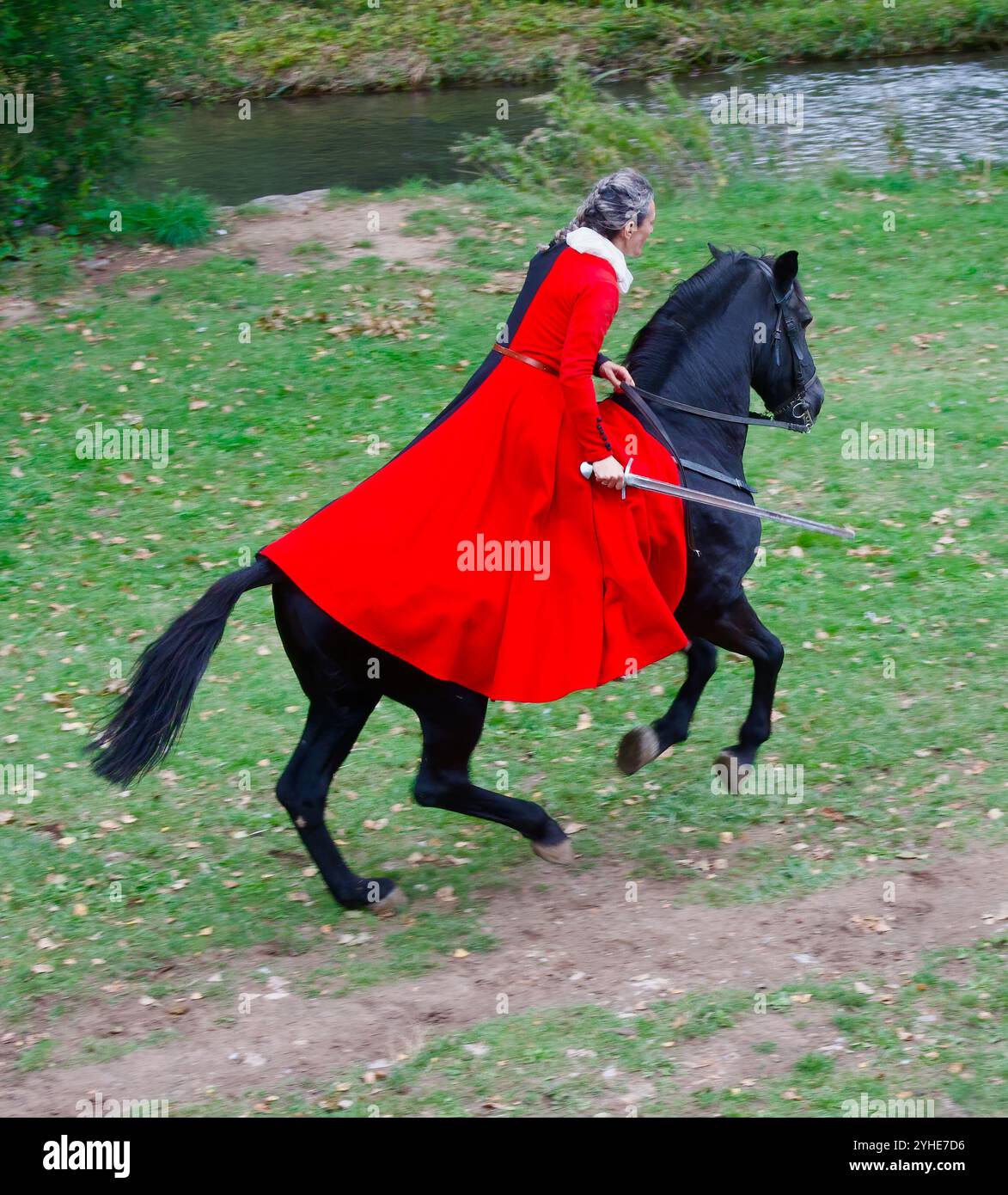 Woman in red dress riding horse hi-res stock photography and images - Alamy