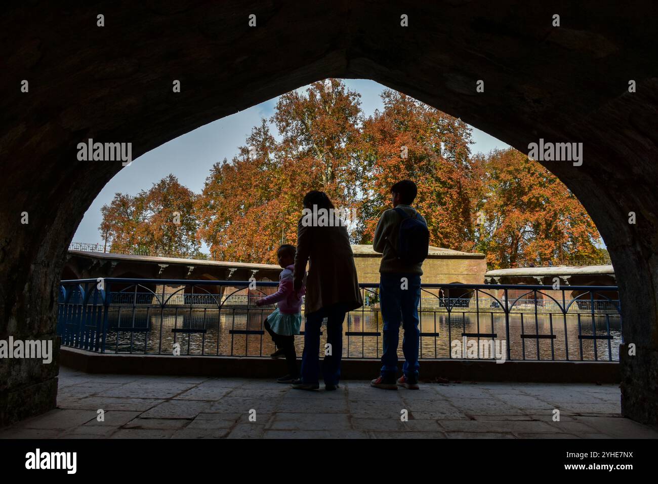 Verinag, India. 11th Nov, 2024. Visitors walk near the Verinag spring ...