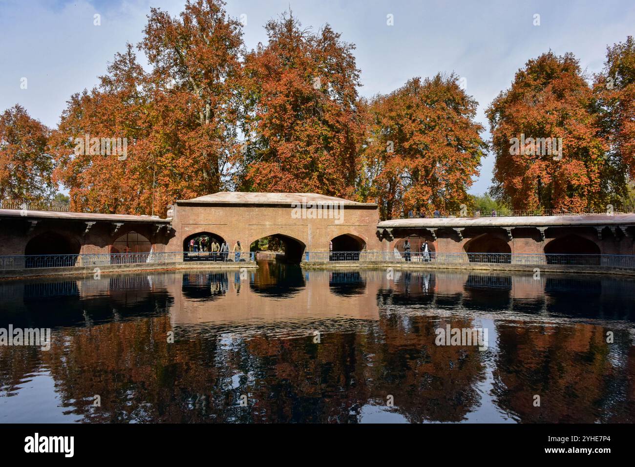 Verinag, India. 11th Nov, 2024. Visitors walk near the Verinag spring ...