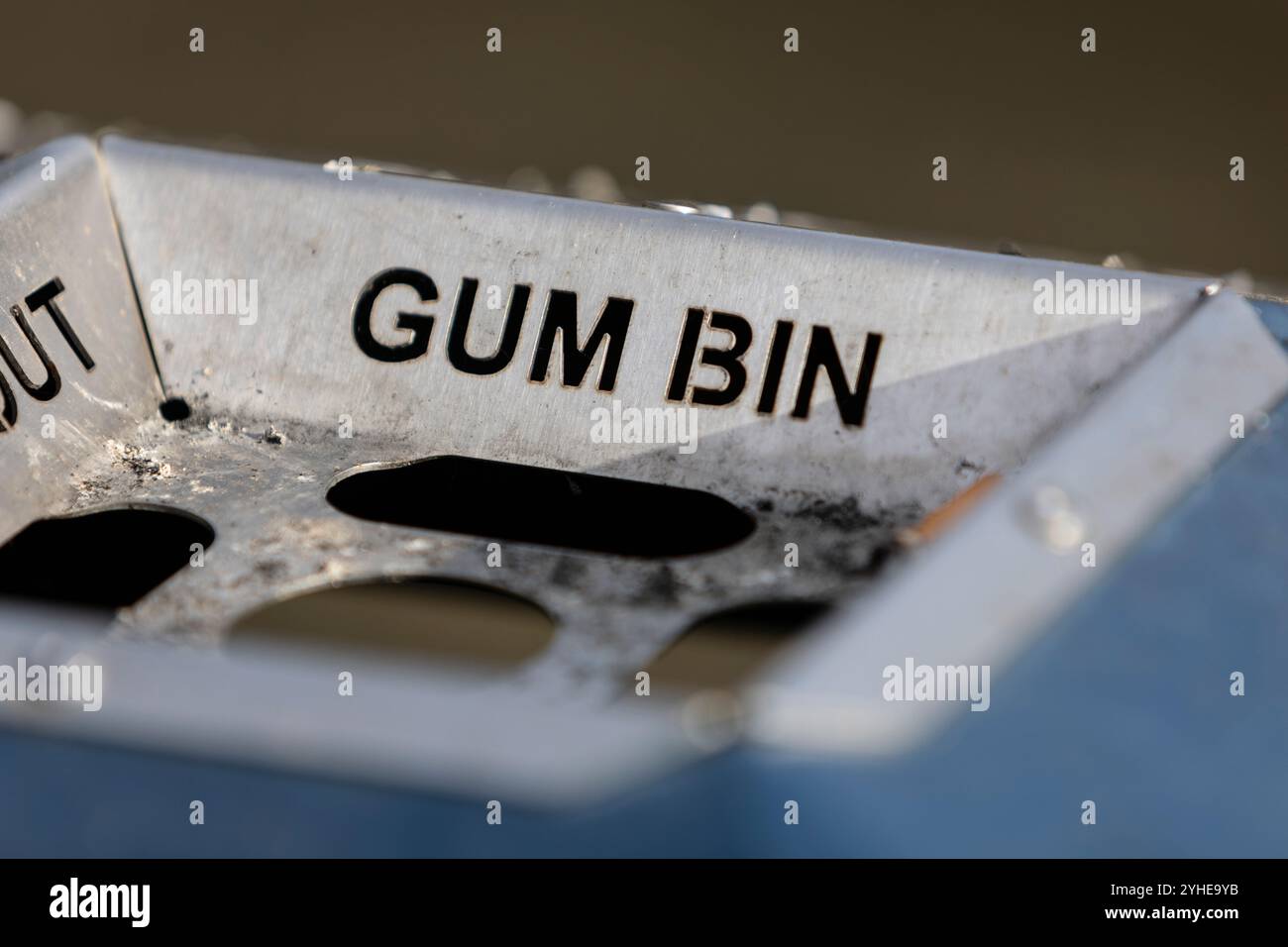 A gum bin sign and cigarette ends on a waste bin Stock Photo - Alamy