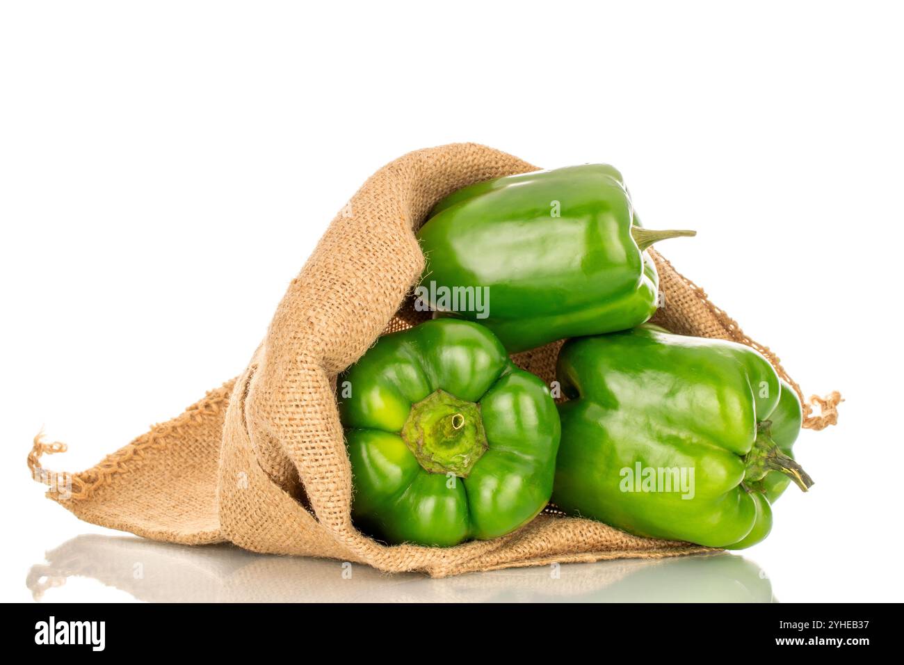 Sweet green capsicum in jute bag, macro, isolated on white background ...
