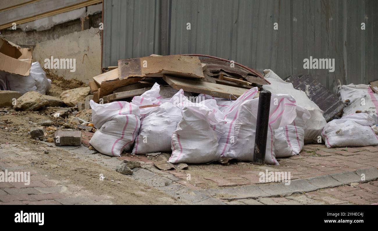 Construction site Garbage bags on the street Stock Photo - Alamy