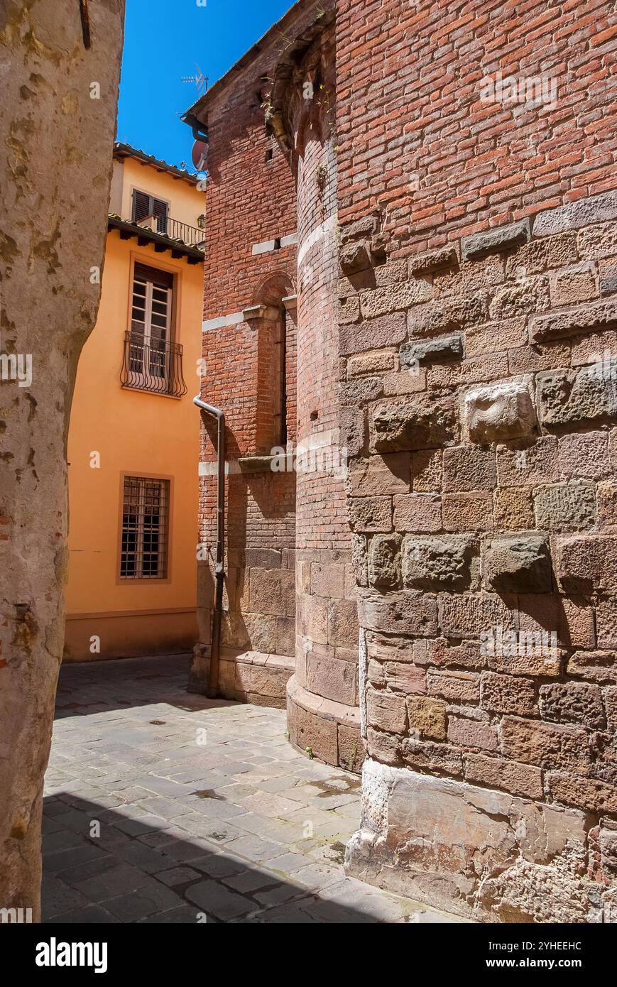 Lucca beautiful medieval historical center alley with St Giulia Church ...