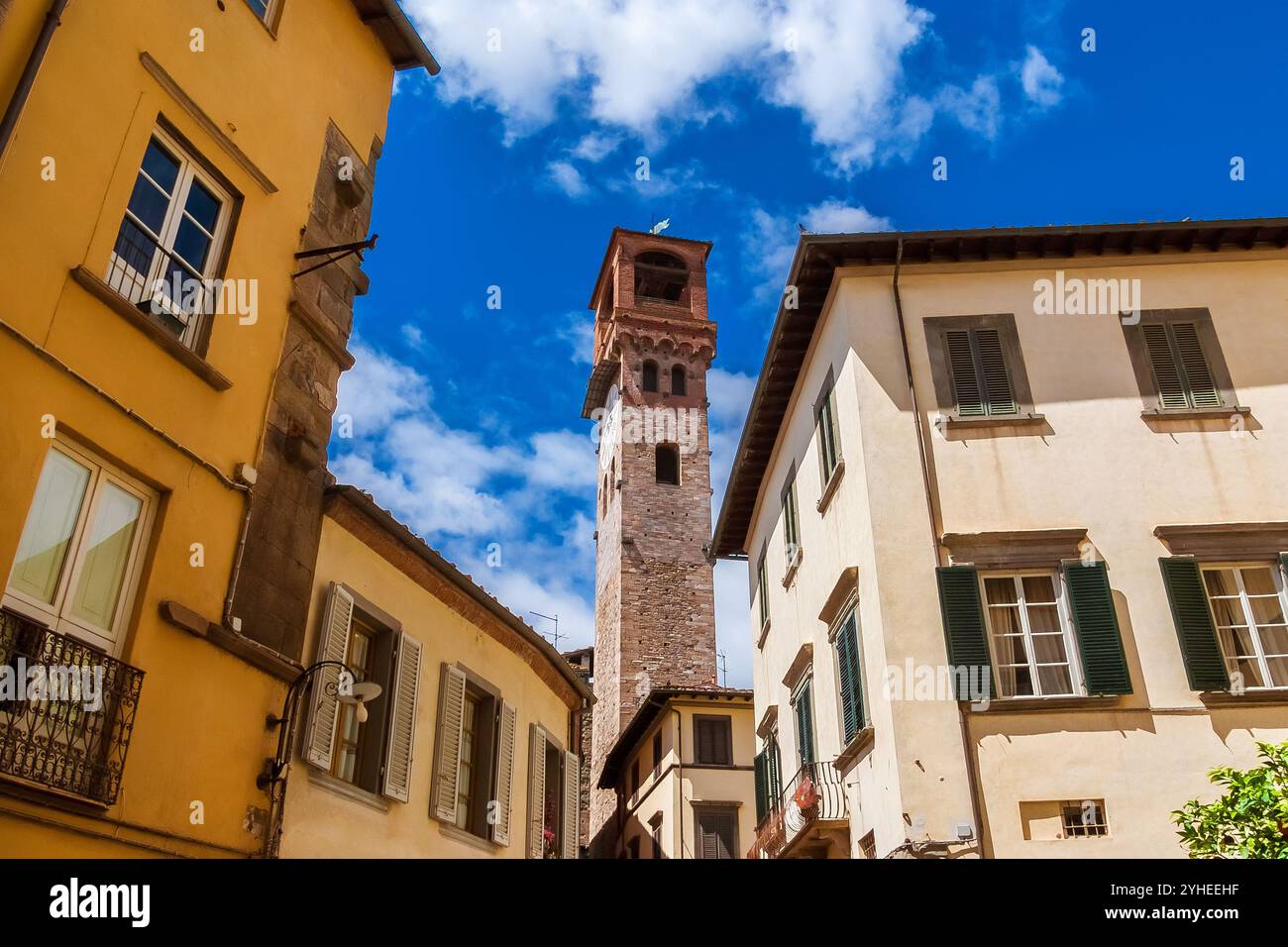 Lucca beautiful medieval historical center alley with old 'Torre dell ...