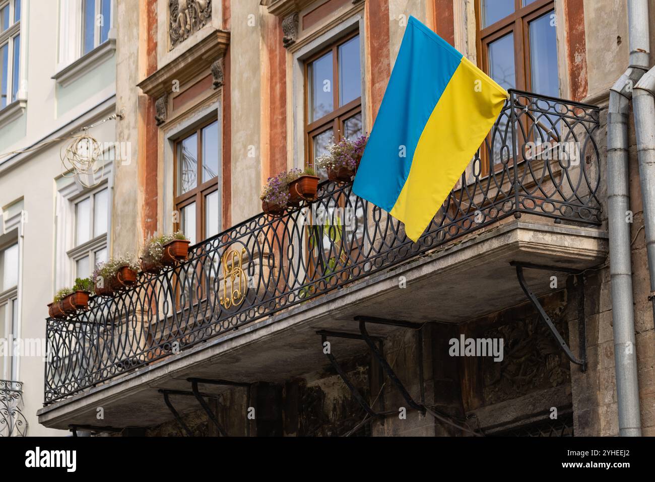 Ukrainian National Flag hanging on balcony in Lviv city center Stock ...