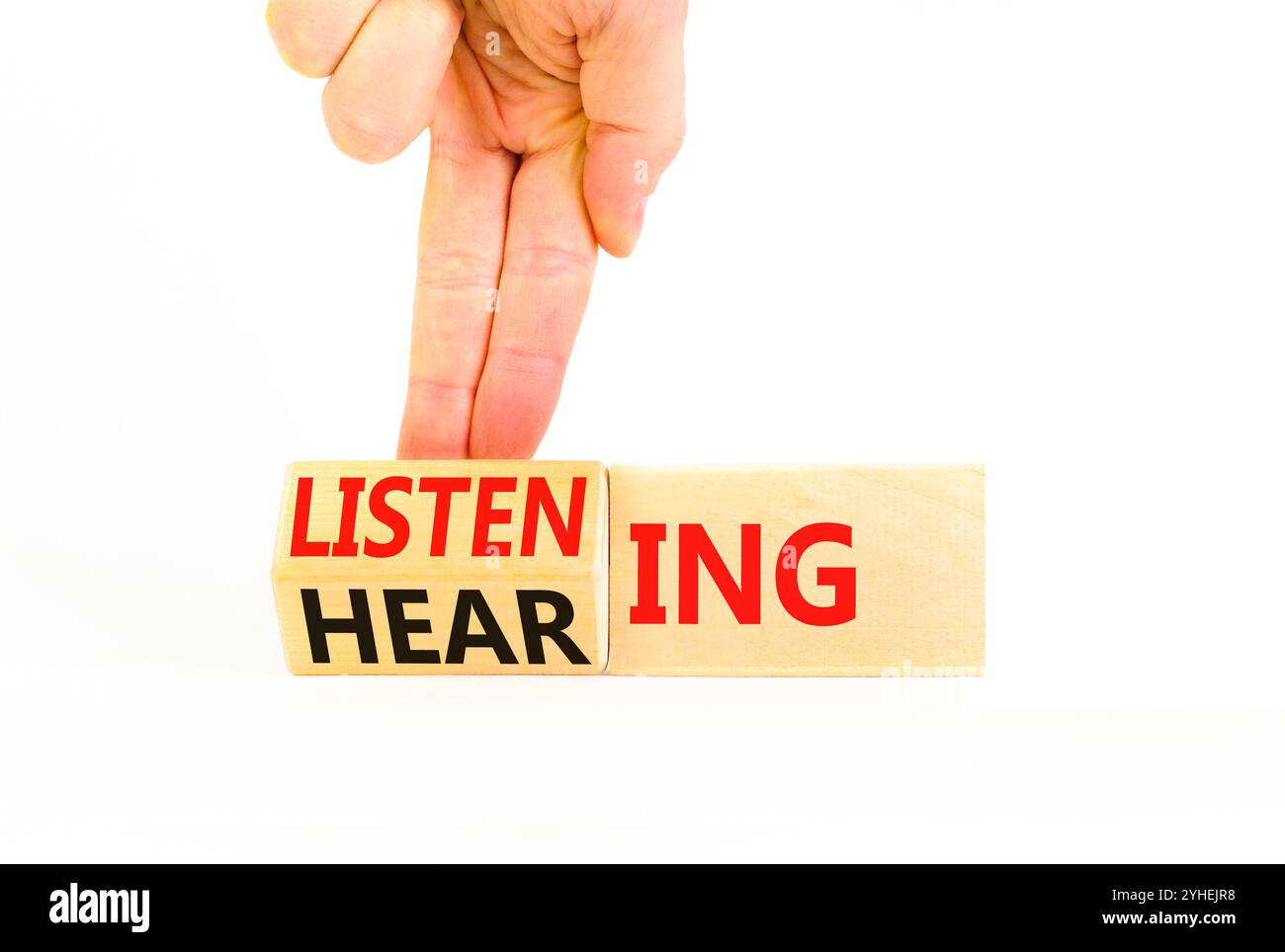 Listening or hearing symbol. Businessman turns wooden cubes and changes ...