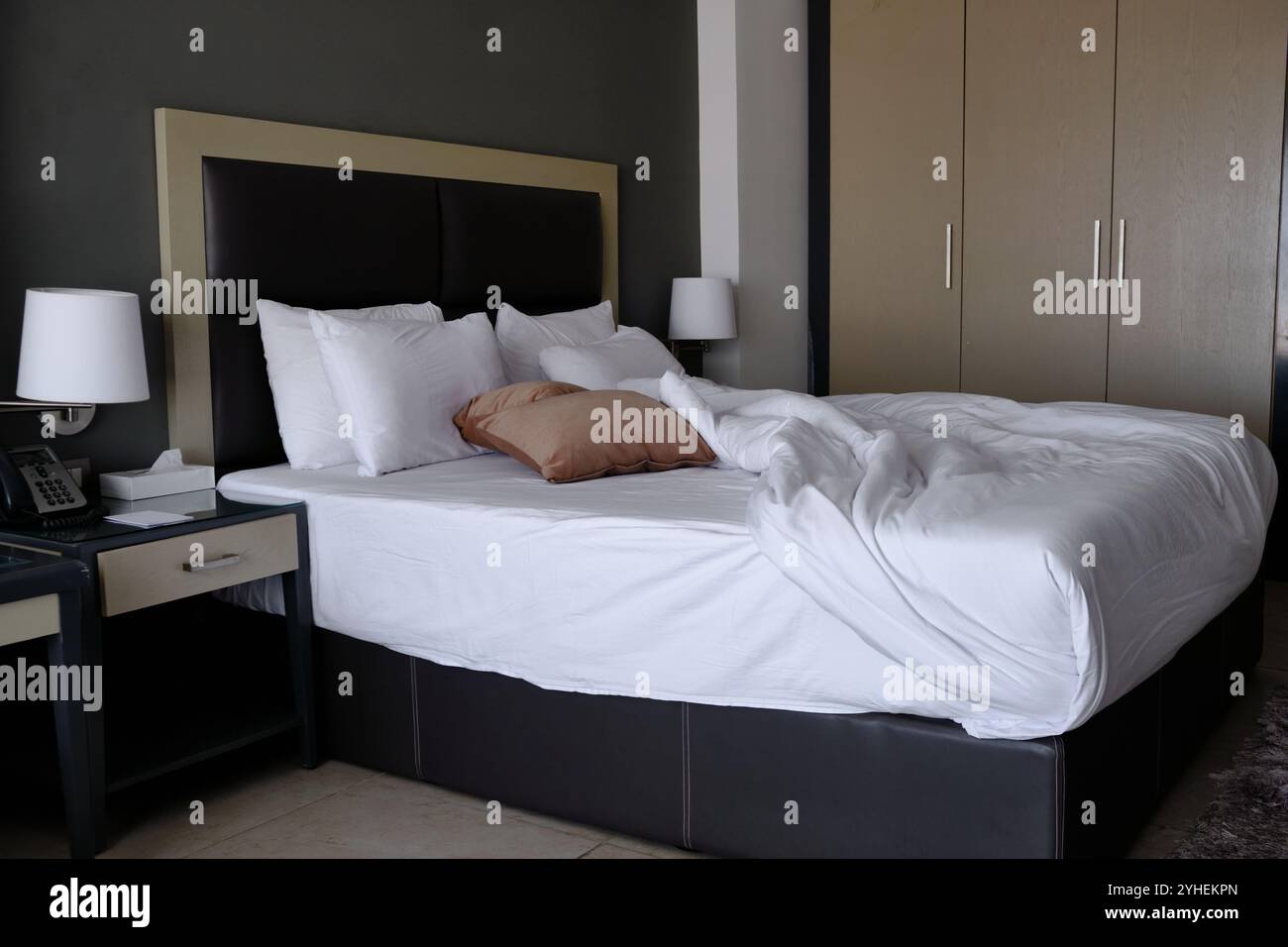 Empty bed in hotel Stock Photo - Alamy