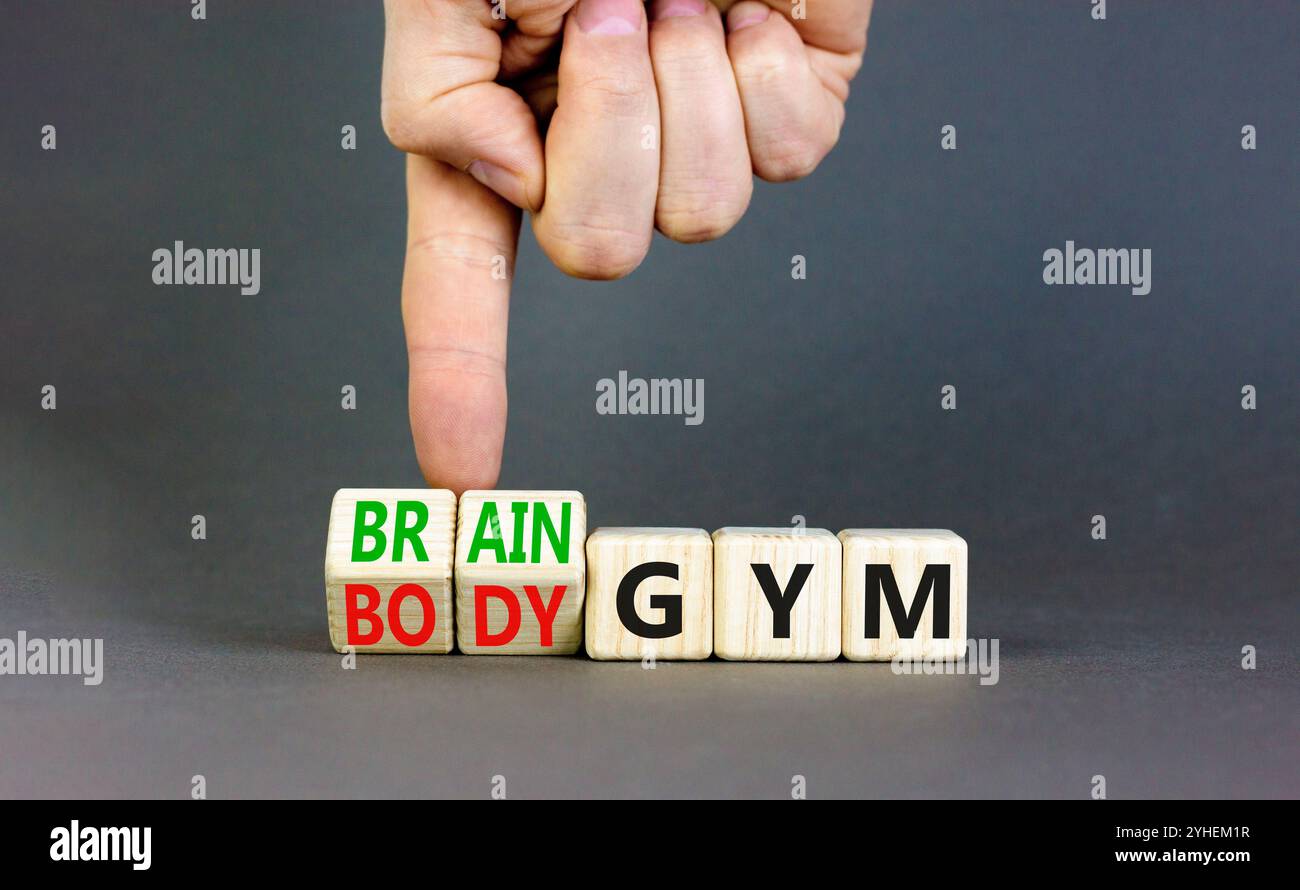 Body vs brain gym symbol. Businessman turns wooden cubes and changes ...