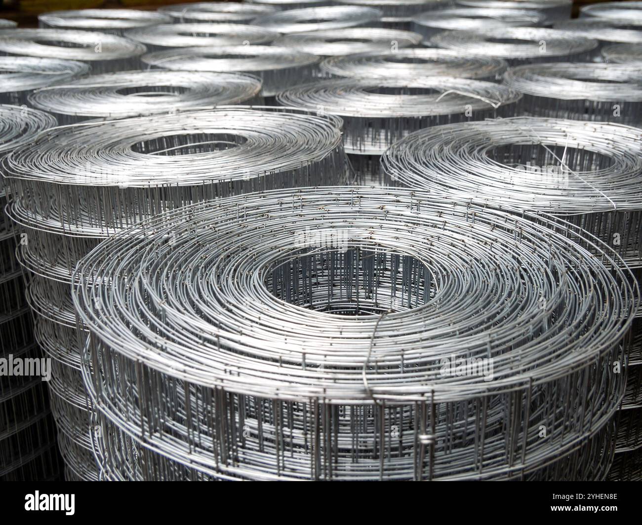 Metal mesh wound in rolls Stock Photo - Alamy