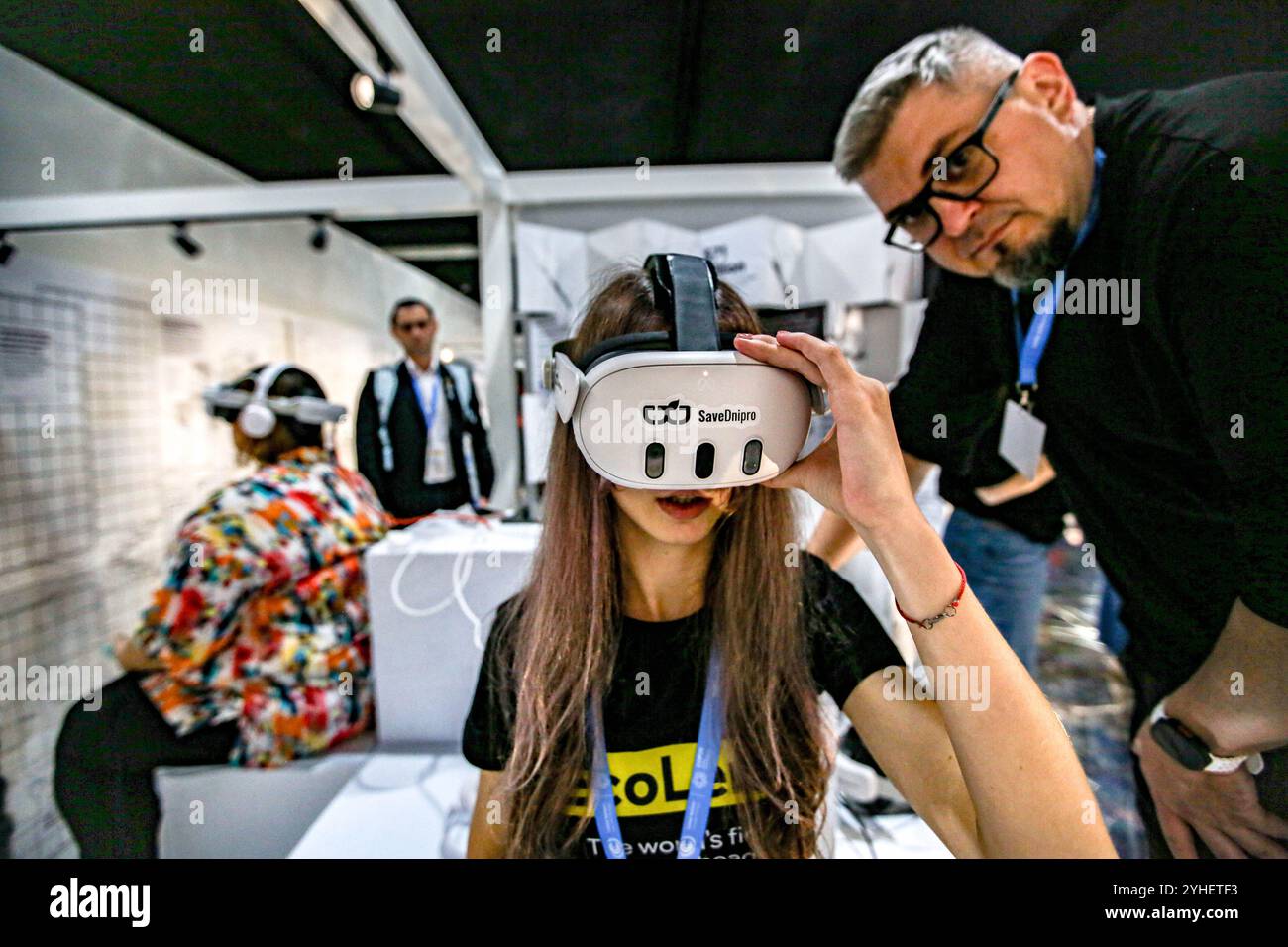 Baku, Azerbaijan, Azerbaijan. 11th Nov, 2024. A woman looks through virtual reality headset ...