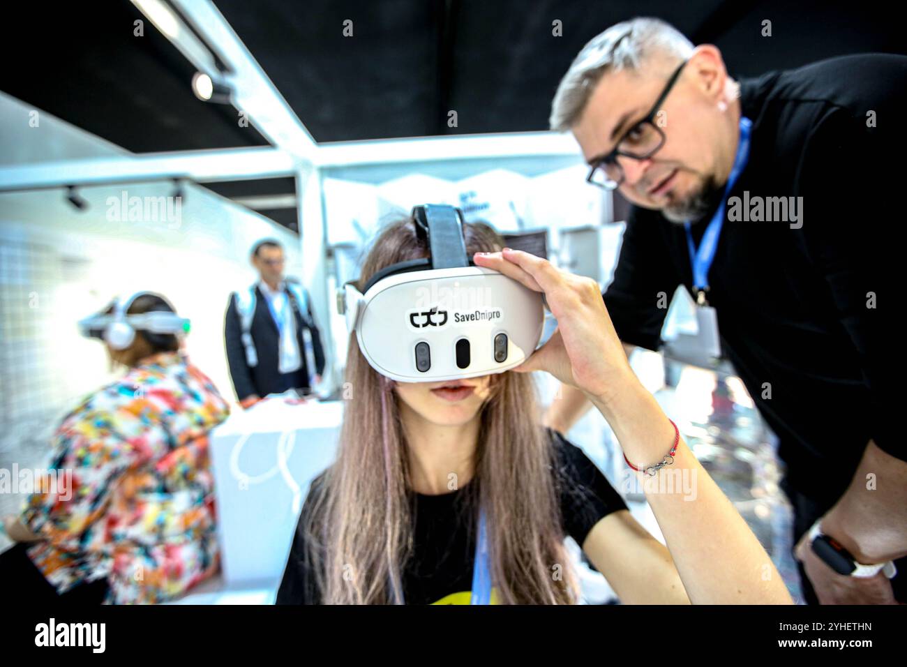 Baku, Azerbaijan, Azerbaijan. 11th Nov, 2024. A woman looks through virtual reality headset ...