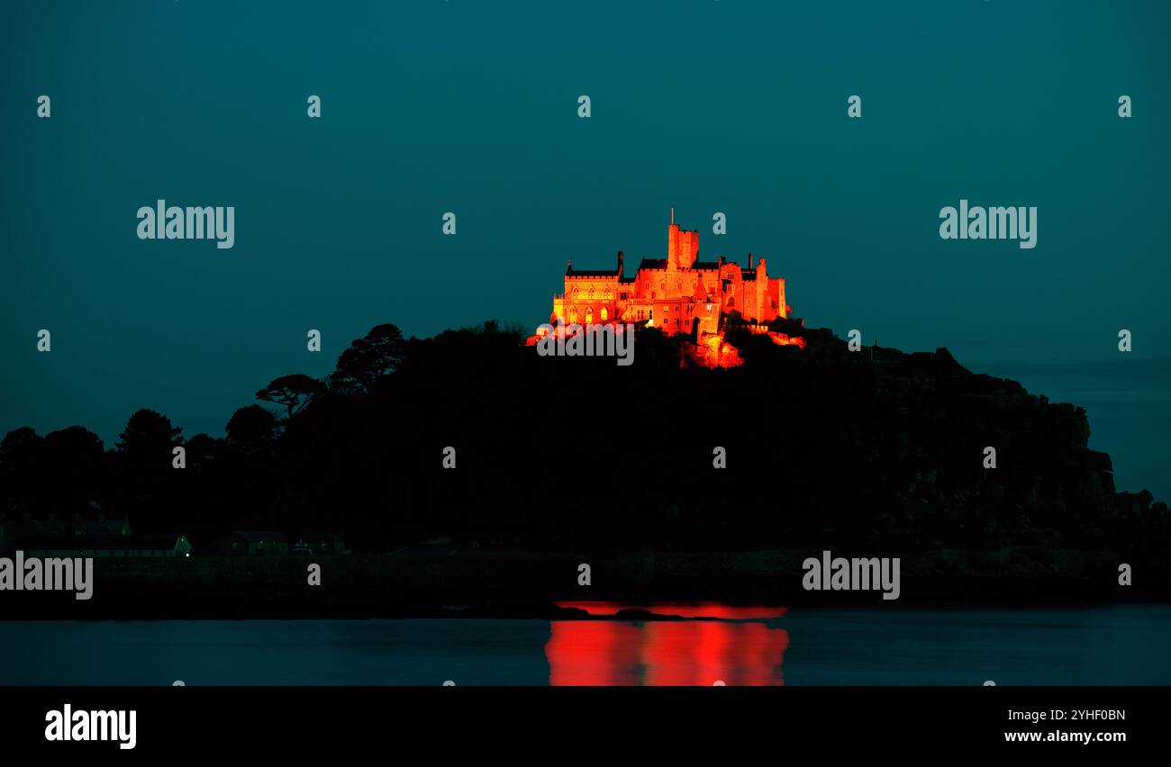 Marazion, Cornwall, UK, 11th Nov 2024. St Michael's Mount lit up in red ...
