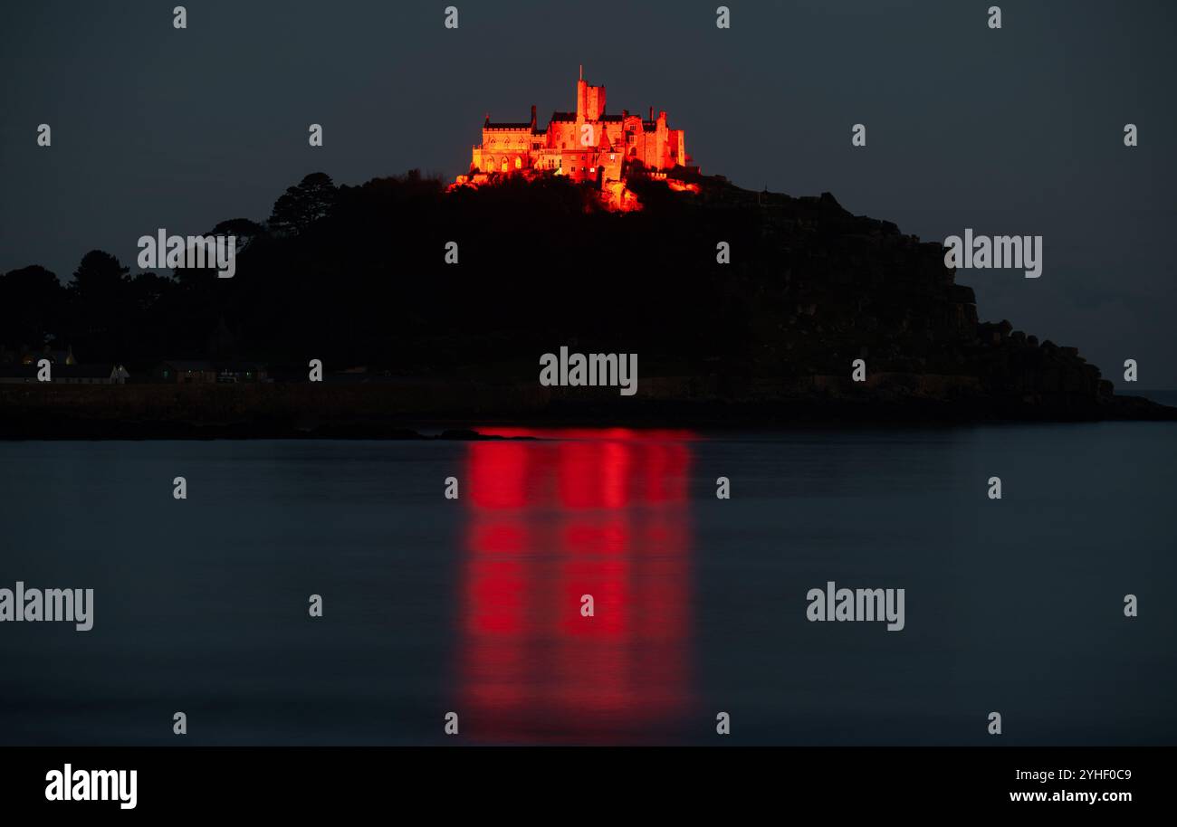Marazion, Cornwall, UK, 11th Nov 2024. St Michael's Mount lit up in red ...