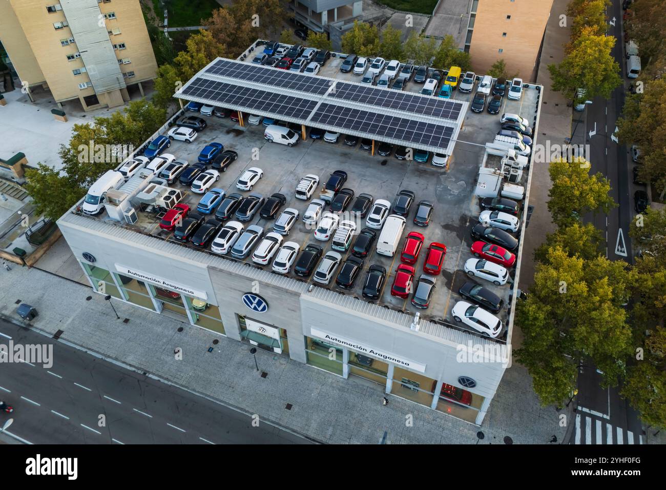 Aerial view of parked vehicles on the rooftop of a Volkswagen car ...
