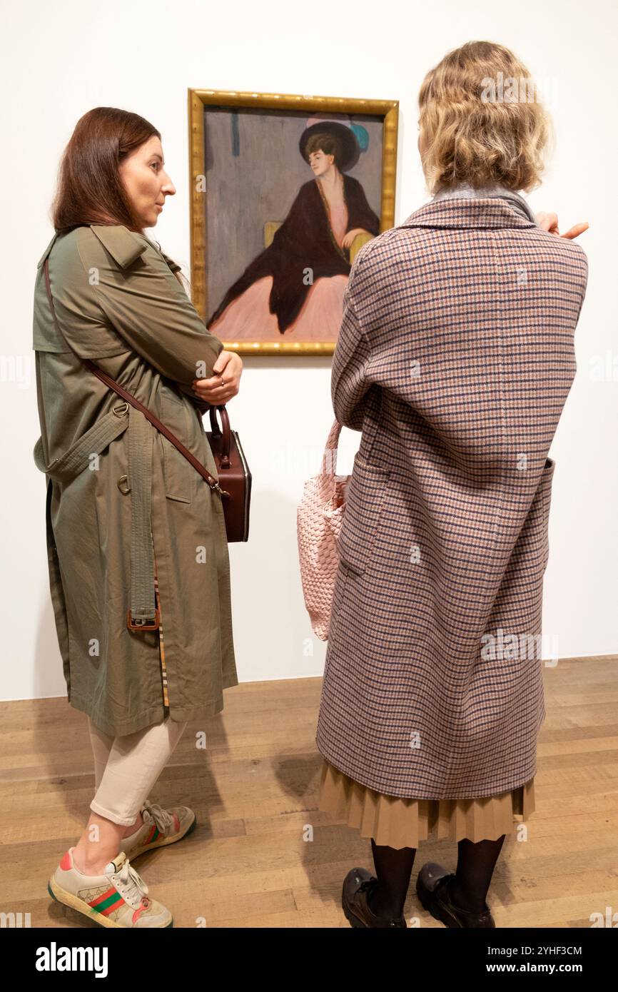 Two women looking at painting by Erma Bossi Portrait of Marianne ...