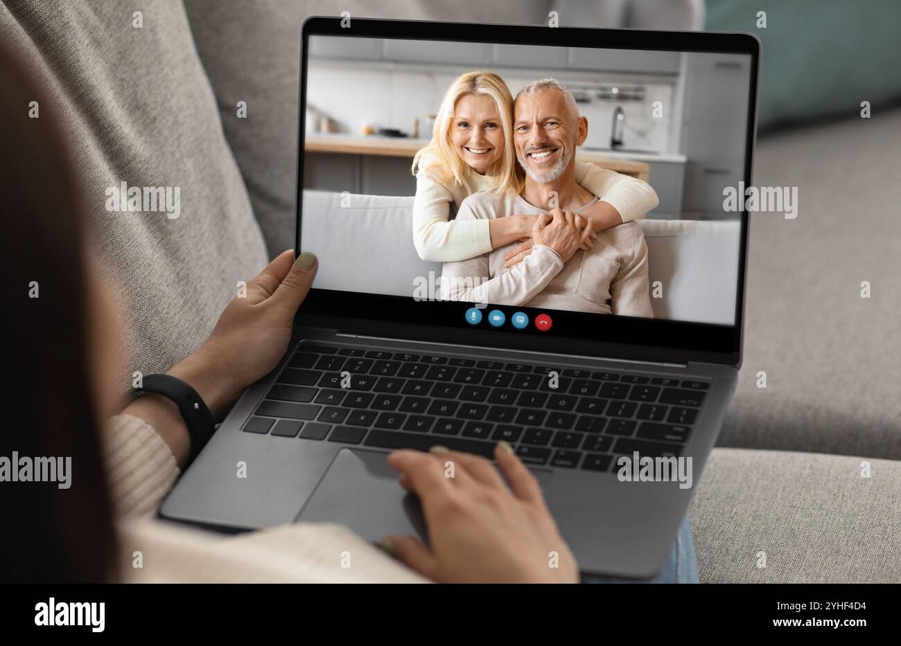 Connecting with family through a virtual video call at home Stock Photo ...