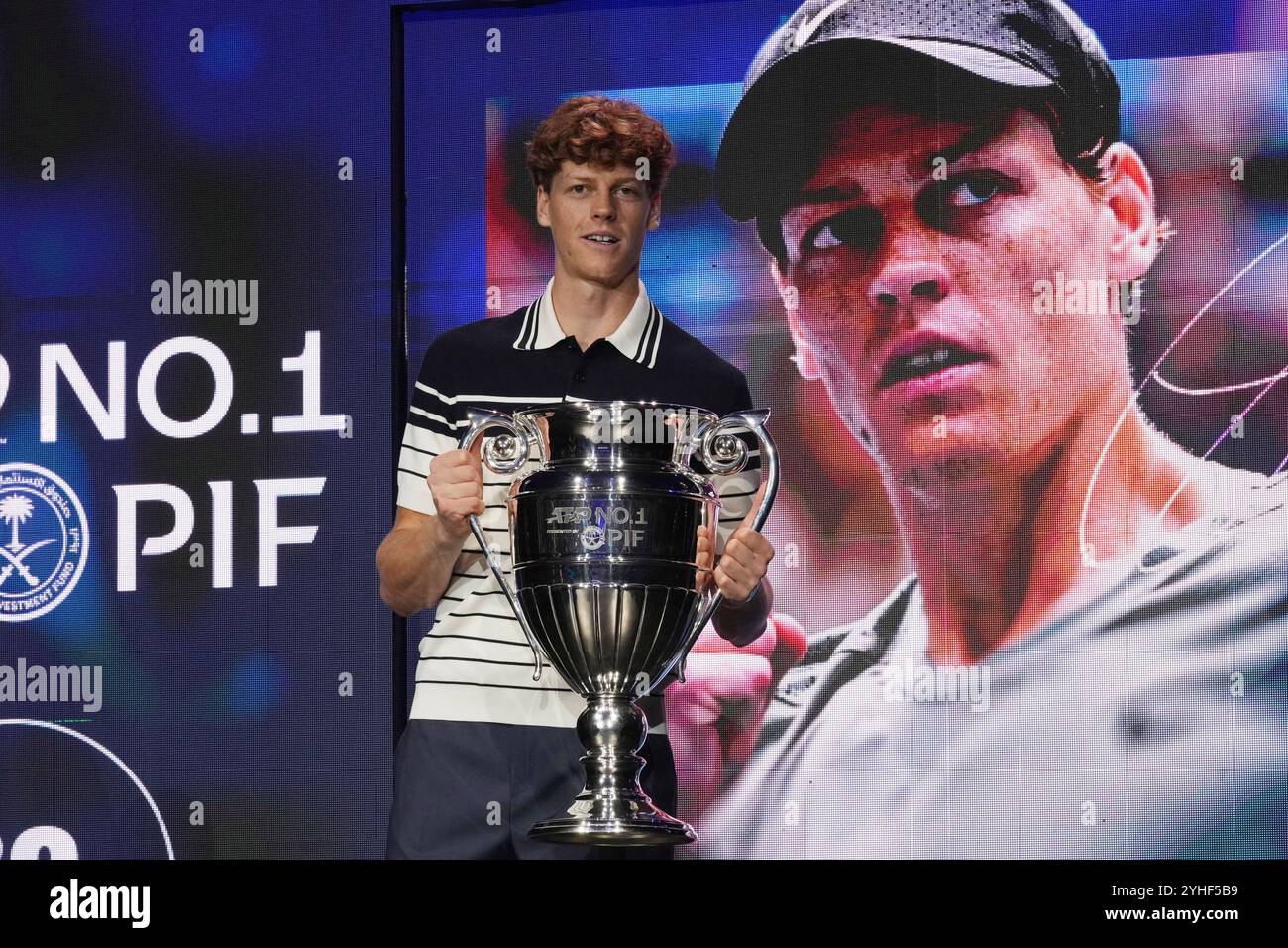 Italy's Jannik Sinner holds the trophy as ATP world best player at the ...