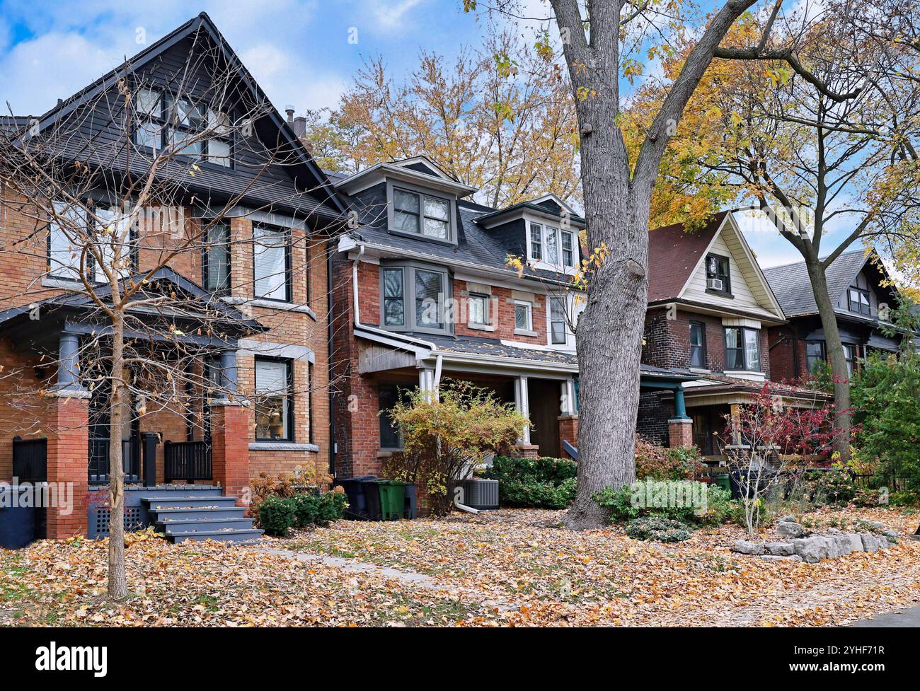 Residential street in fall with large old houses Stock Photo - Alamy